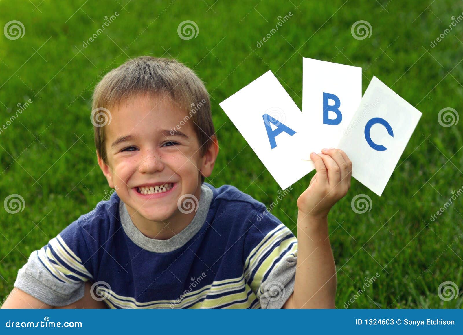 Boy Holding ABC S stock image. Image of alphabet, childhood - 1324603