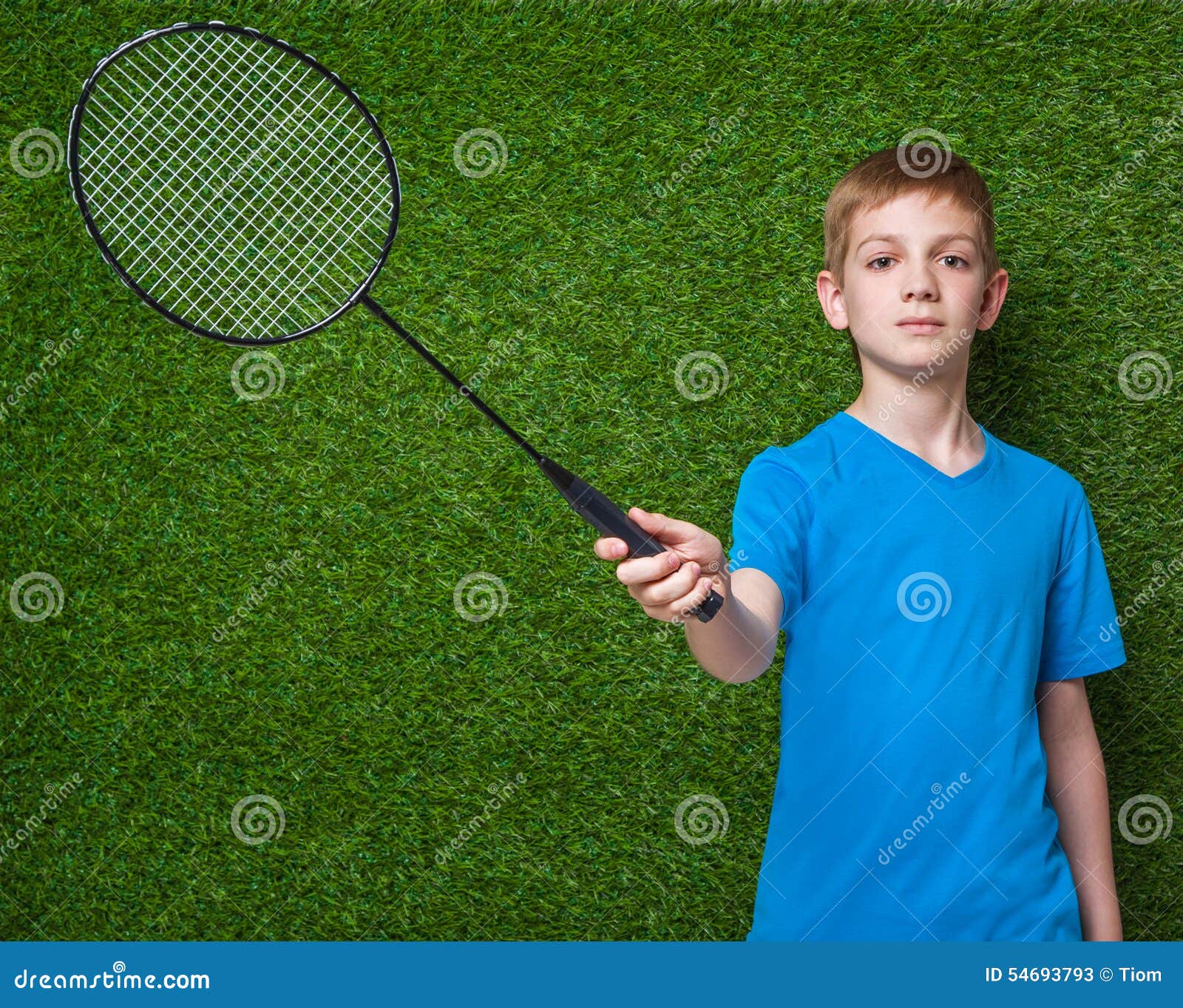 Boy Holding Badminton Racket Over Green Grass Stock Image - Image of ...