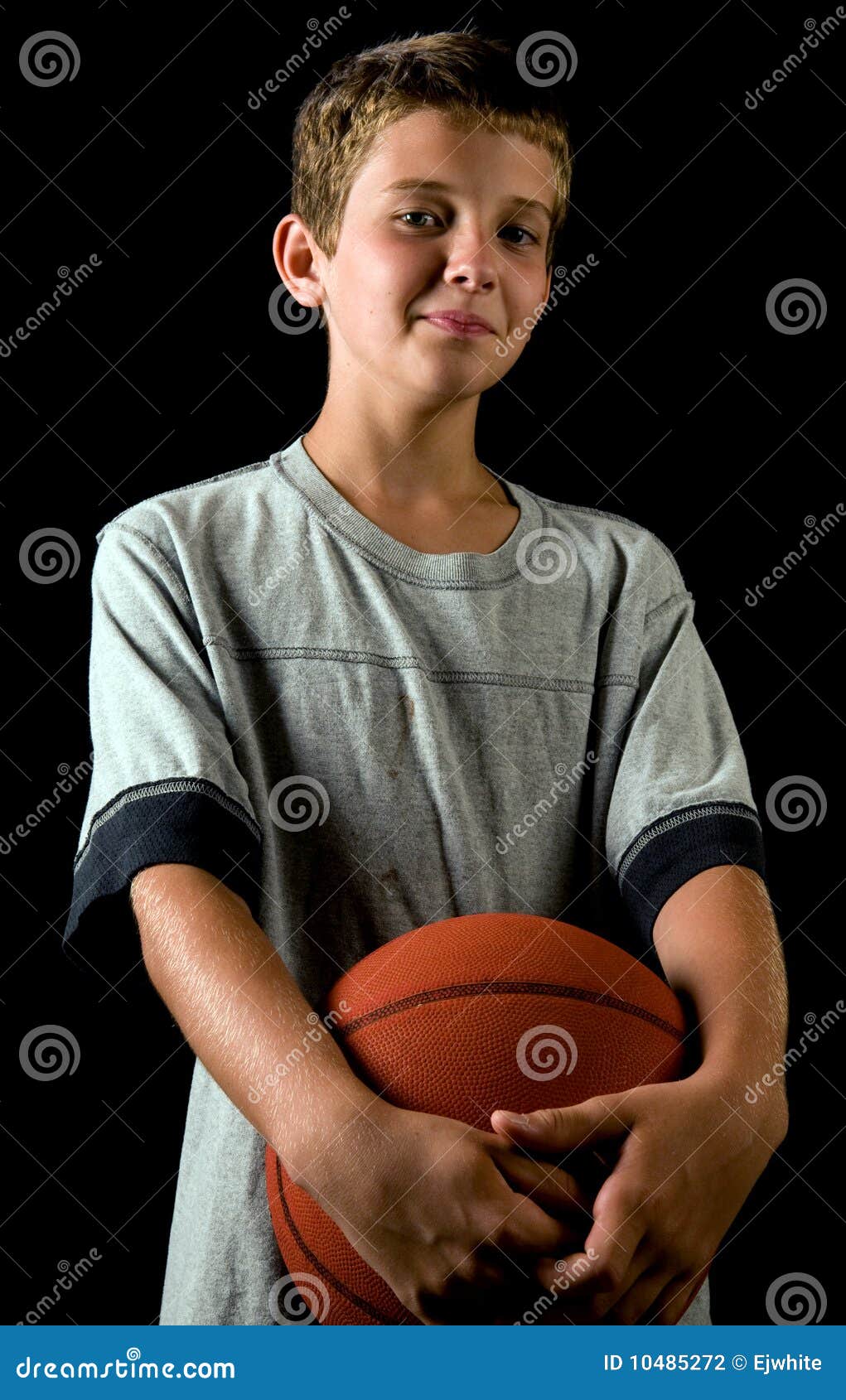 Boy holding basketball stock photo. Image of grinning - 10485272