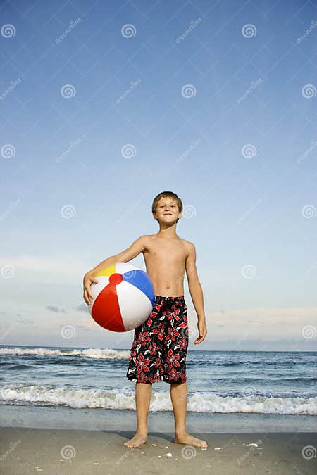 Boy Holding Beachball on Beach. Stock Image - Image of looking, copy ...