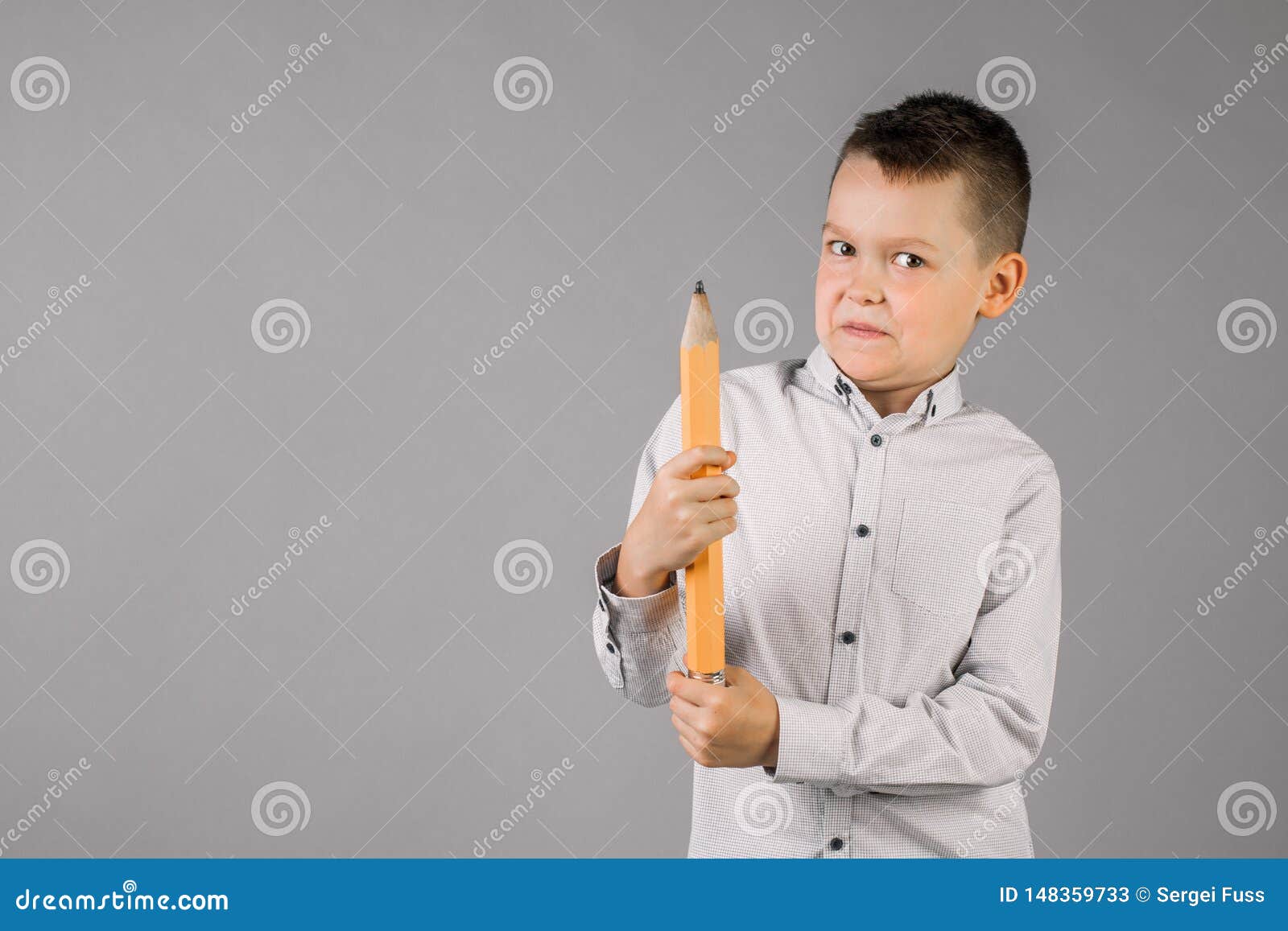 Boy is Holding a Big Pencil, Concept of School, Education Stock Image ...