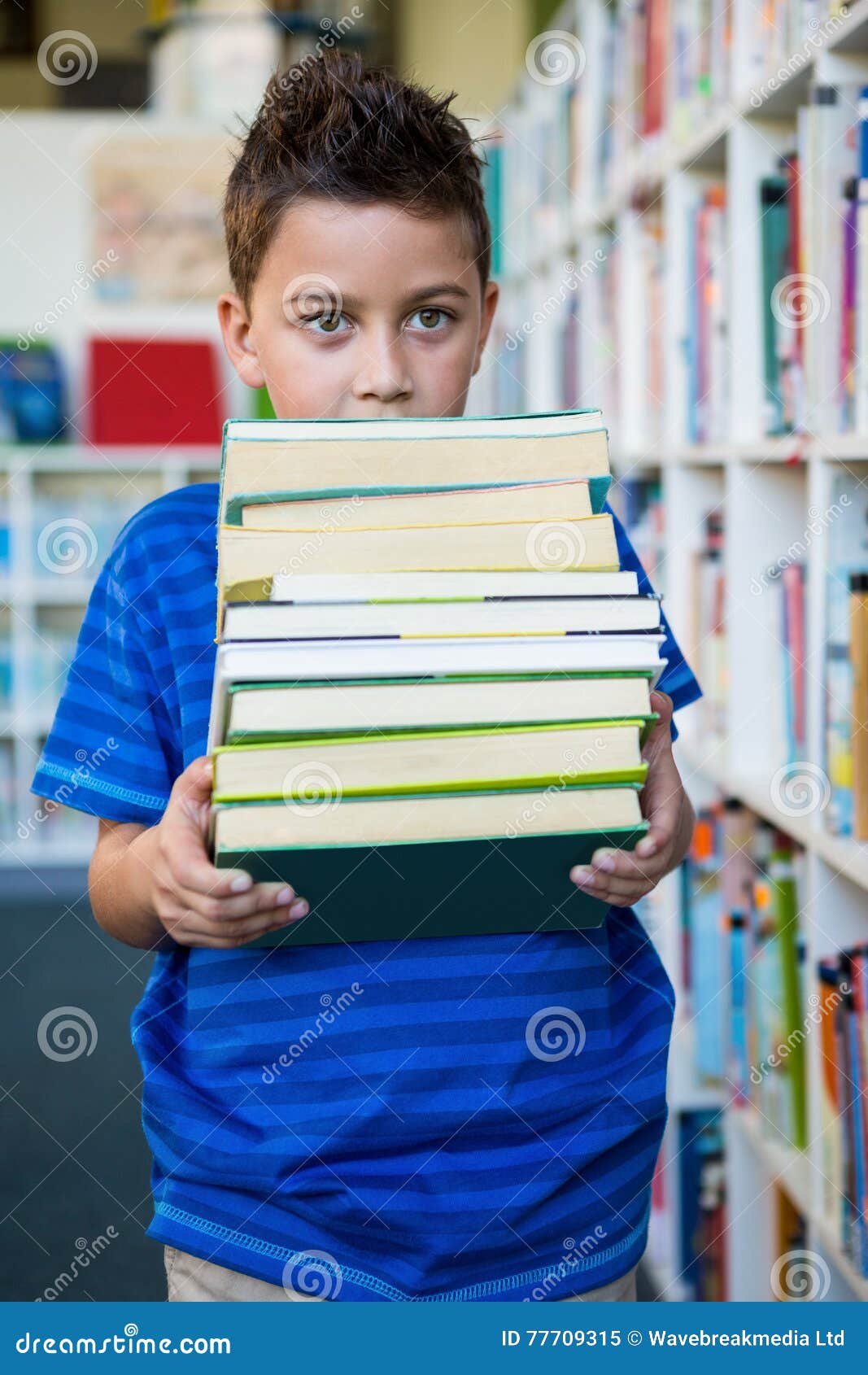 Boy Holding Books in School Library Stock Image - Image of mixedrace ...