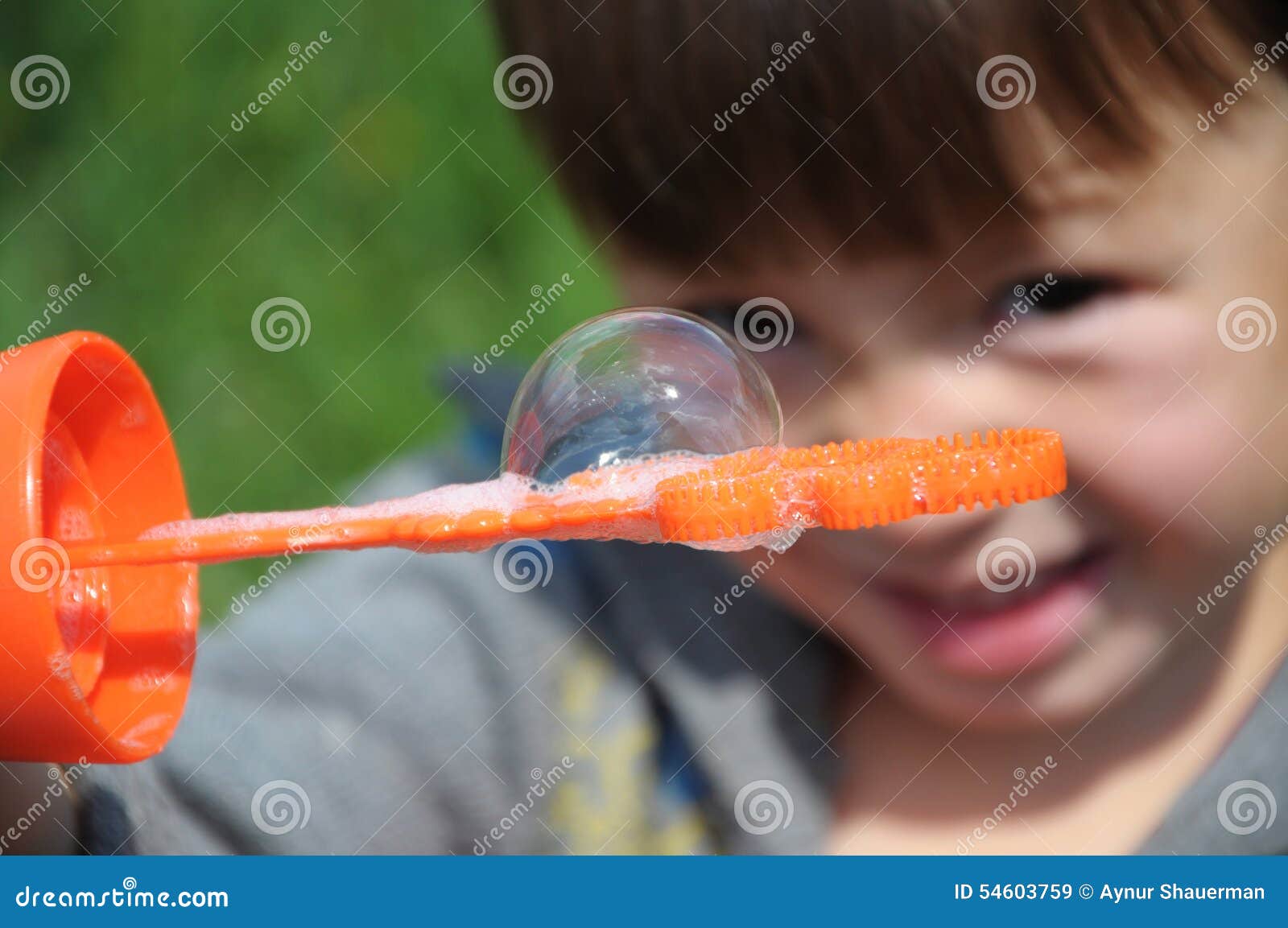 Boy Holding the Bubble on Stick Stock Image - Image of blowing, blow ...
