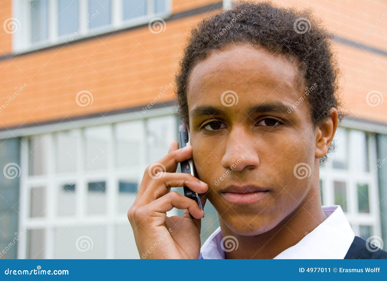 Boy holding cellphone stock image. Image of cellphone - 4977011