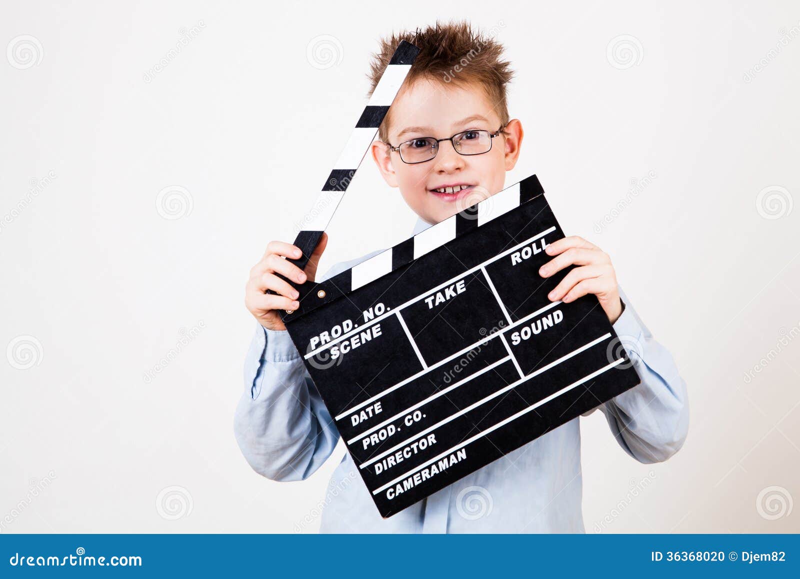Boy holding clapper board stock photo. Image of business - 36368020