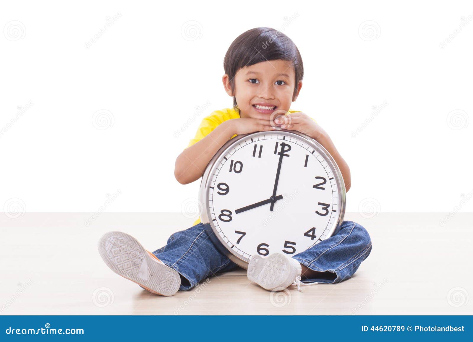 Boy holding clock stock image. Image of horizontal, minute - 44620789