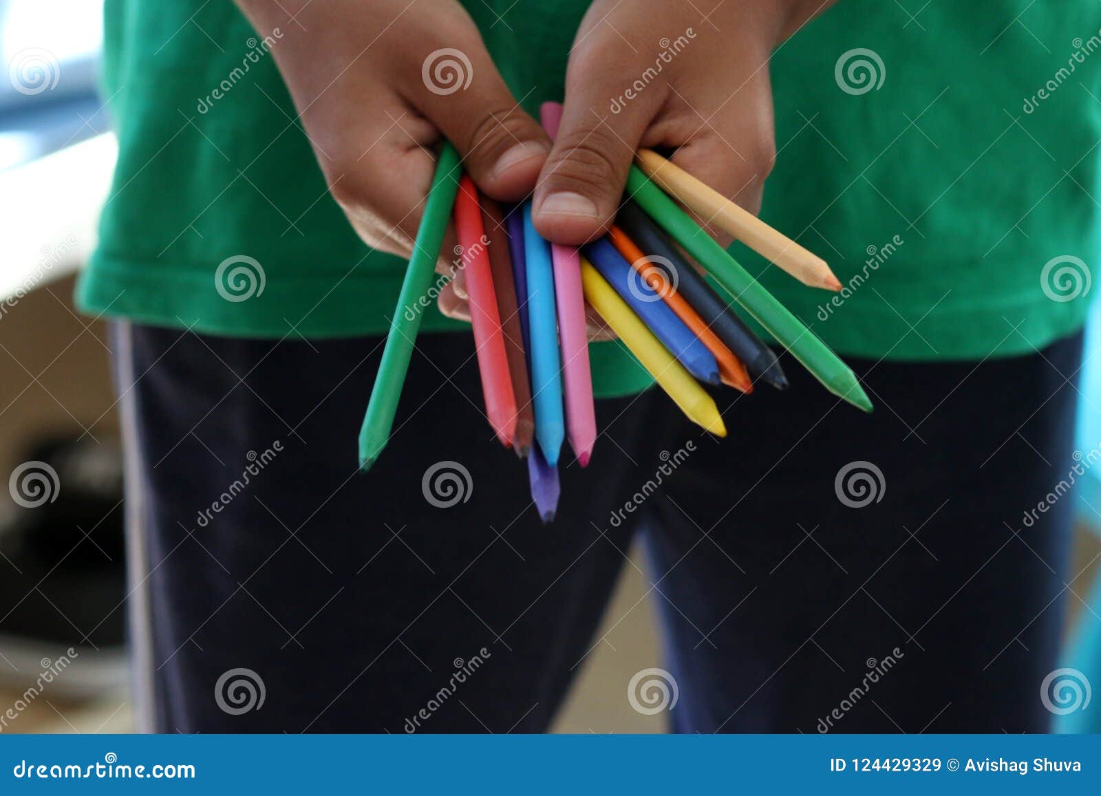 A Boy Holding Colored Pencils Stock Image - Image of school, education ...
