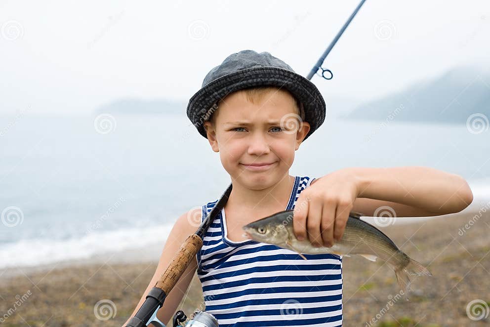 Boy holding a fish stock photo. Image of action, activity - 29272510