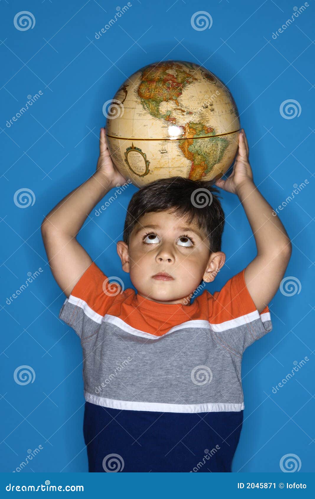 Boy holding globe on head stock image. Image of earth - 2045871