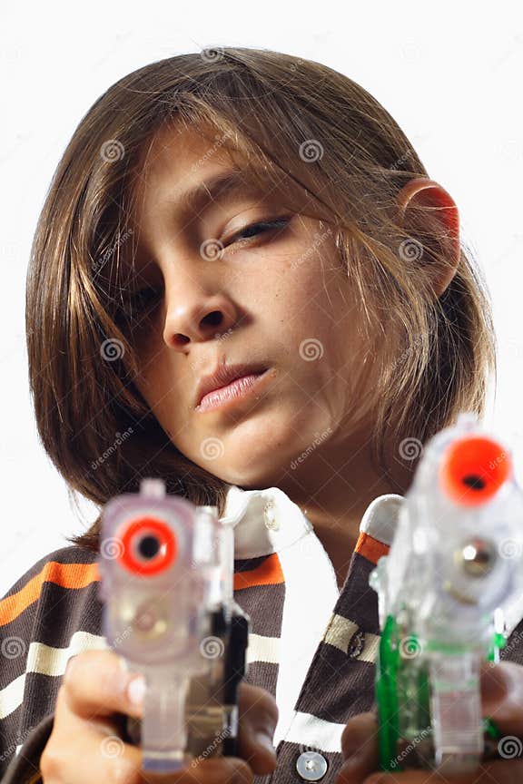 Boy Holding Guns stock photo. Image of copyspace, serious - 5381208