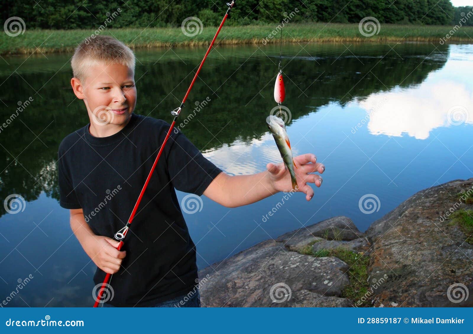 Boy holding his catch stock image. Image of fish, child - 28859187
