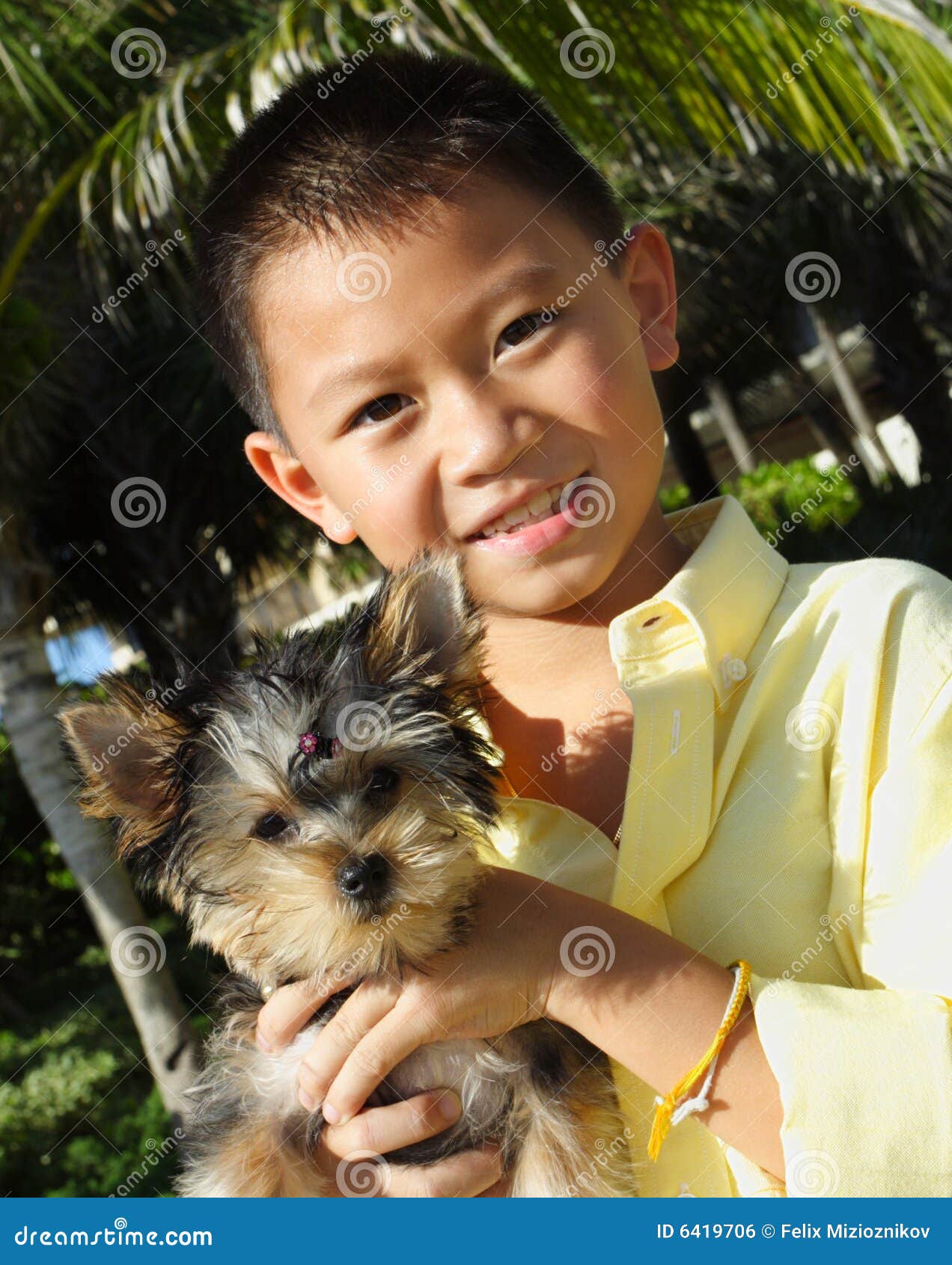 Boy holding his puppy stock photo. Image of filipino, nature - 6419706