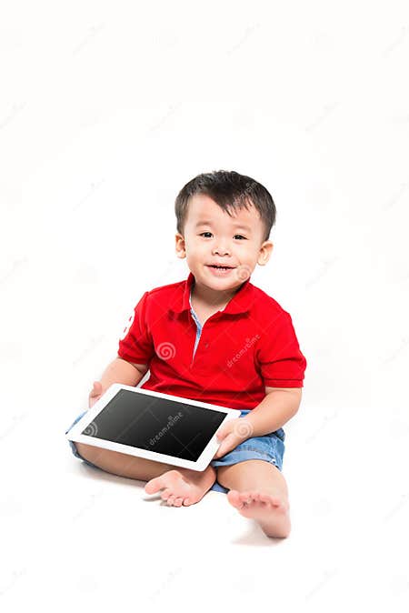 Boy holding ipad stock photo. Image of sitting, technology - 55321898