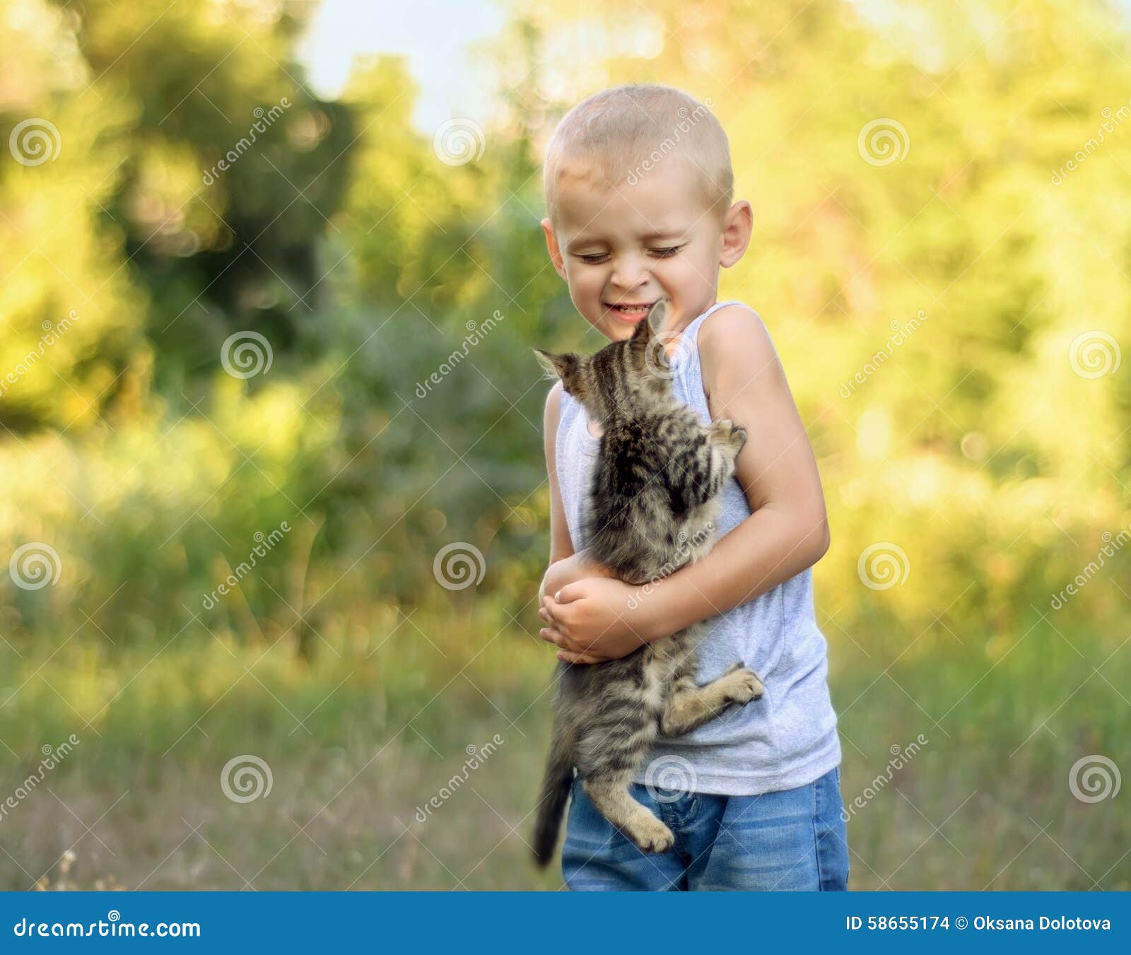 Boy holding kitten stock photo. Image of kitten, childhood - 58655174