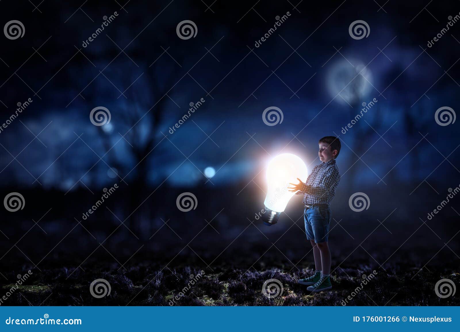 Boy holding a light bulb stock photo. Image of idea - 176001266