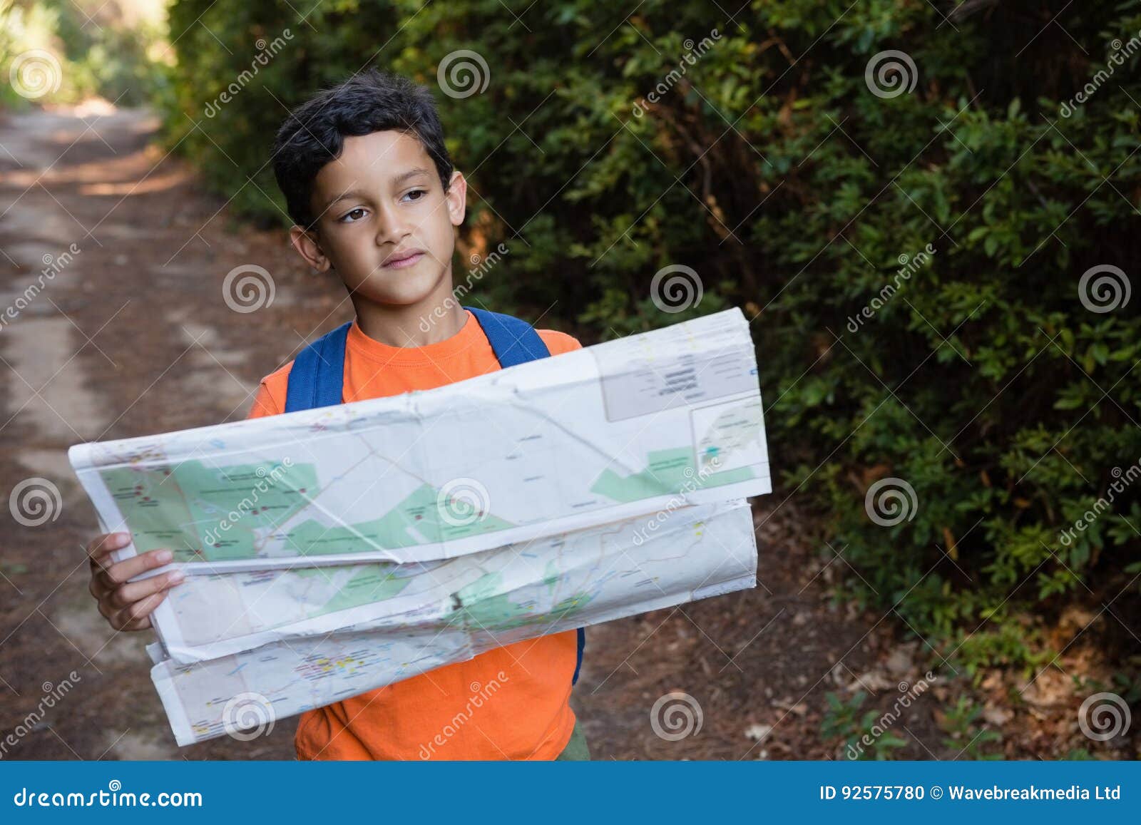 Boy Holding the Map and Looking at the Distance Stock Photo - Image of ...