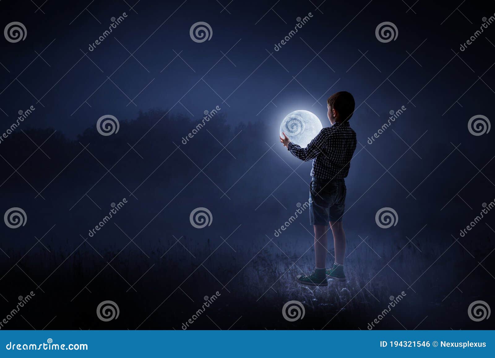 Boy holding moon at night stock photo. Image of nature - 194321546