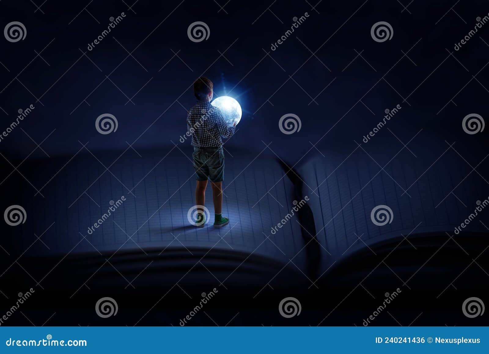Boy holding moon at night stock photo. Image of background - 240241436