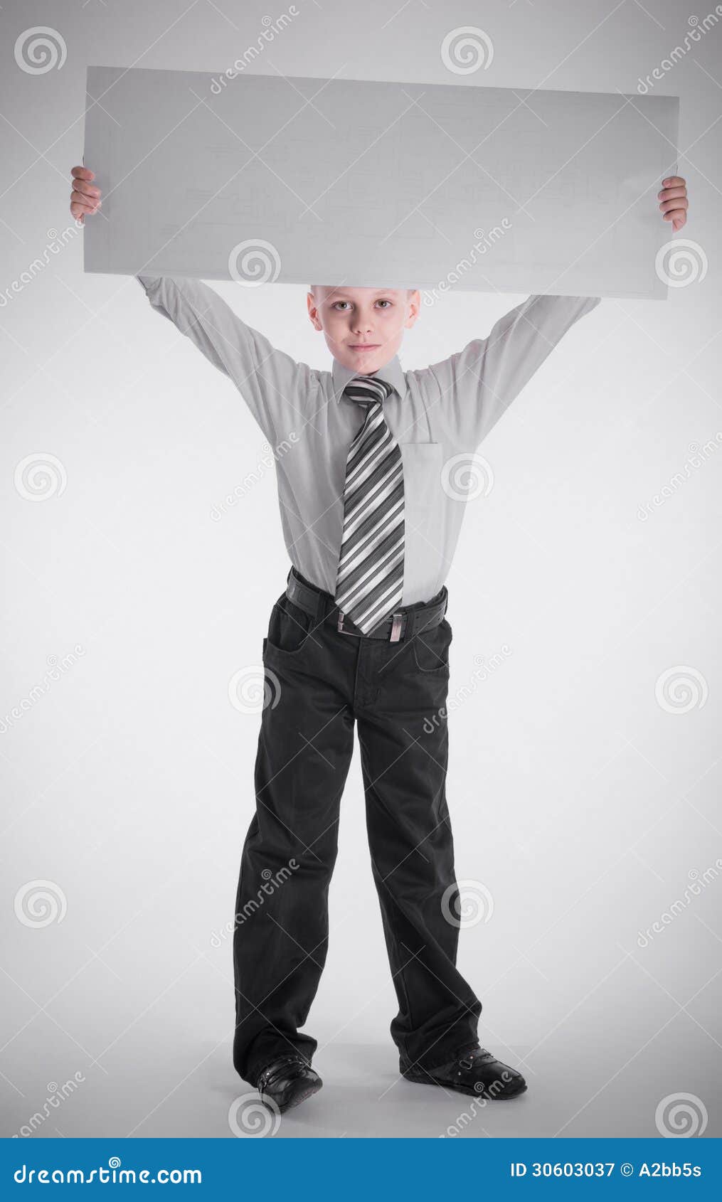 A boy holding nameplate stock image. Image of front, full - 30603037