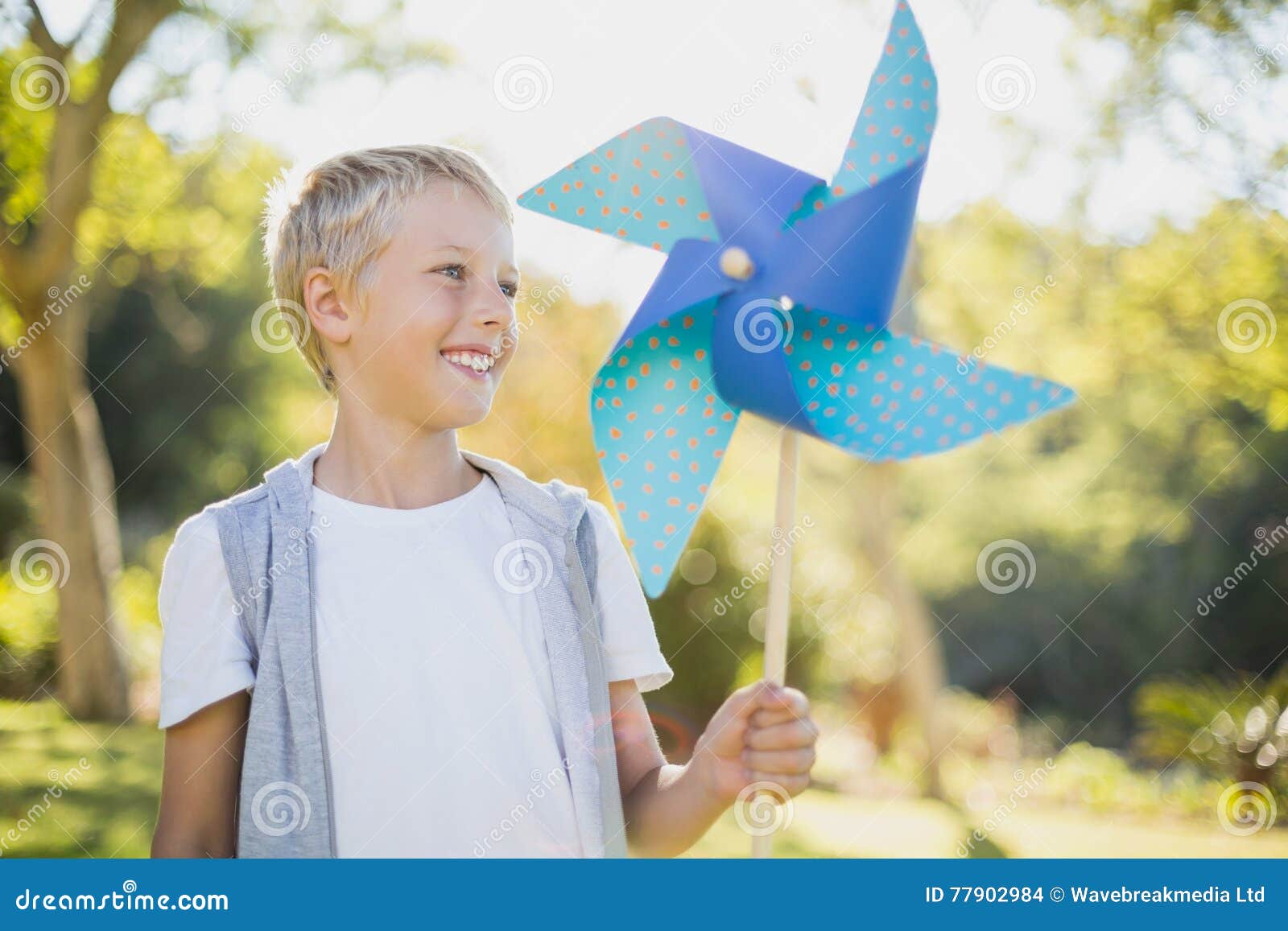 Boy Holding a Pinwheel in Park Stock Photo - Image of multiethnic, park ...