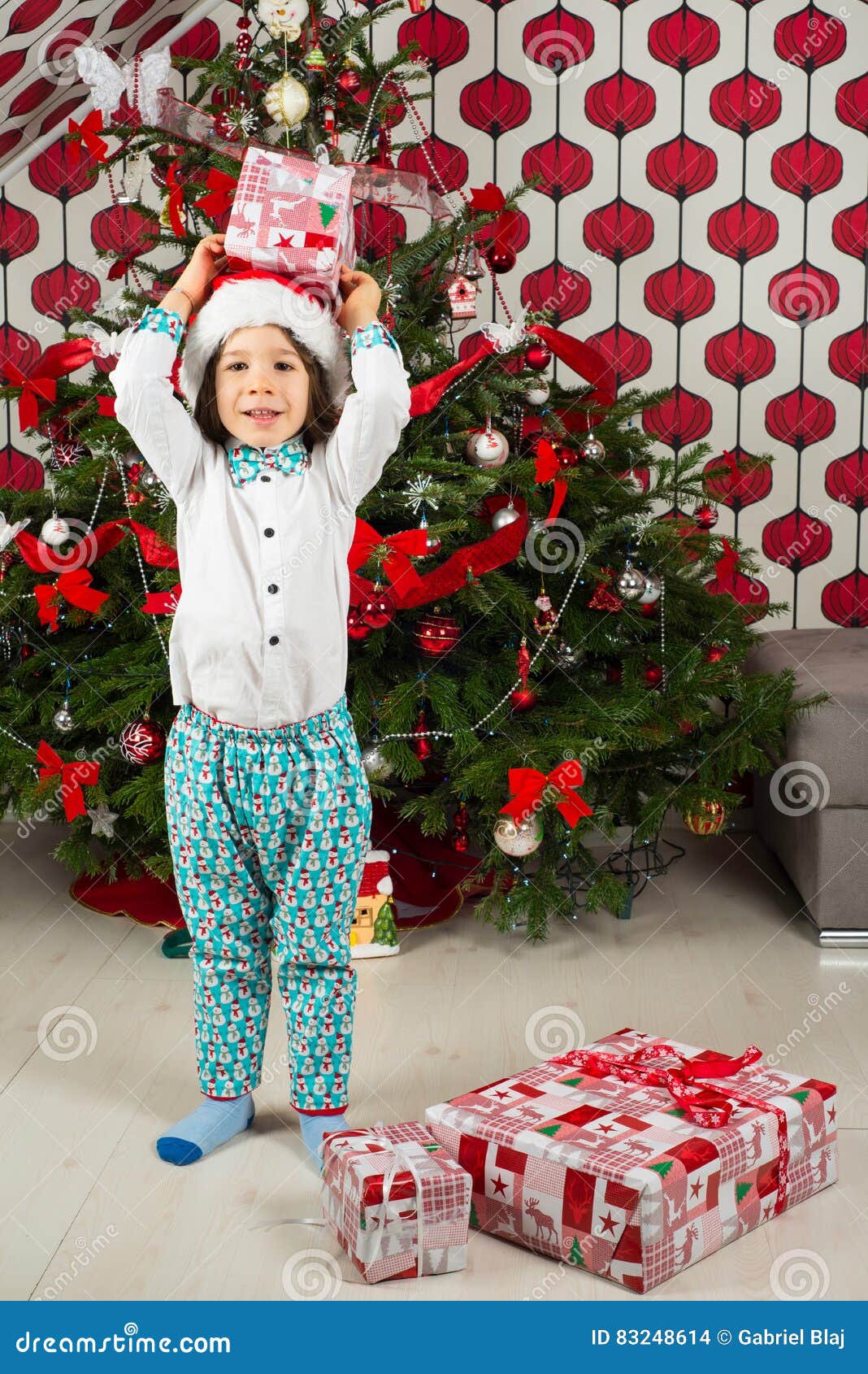 Boy Holding Present Above the Head Stock Photo - Image of beauty ...