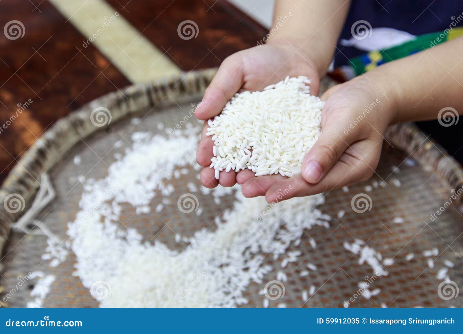 Boy holding rice stock image. Image of agriculture, holding - 59912035