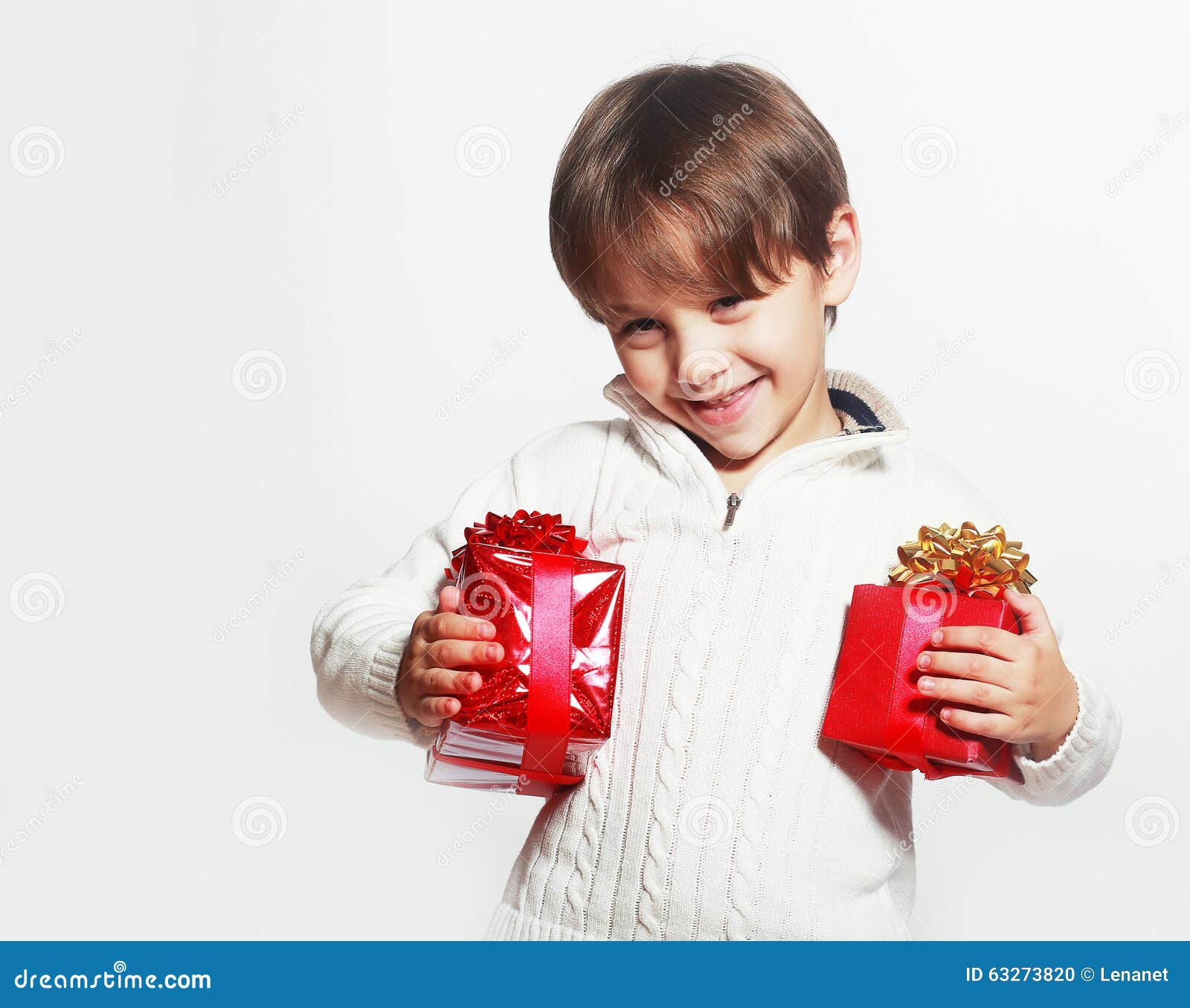 Boy holding two presents stock photo. Image of container - 63273820