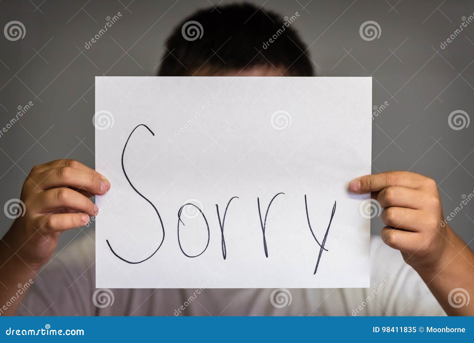 Boy Holding Up Sorry stock image. Image of finger, people - 98411835