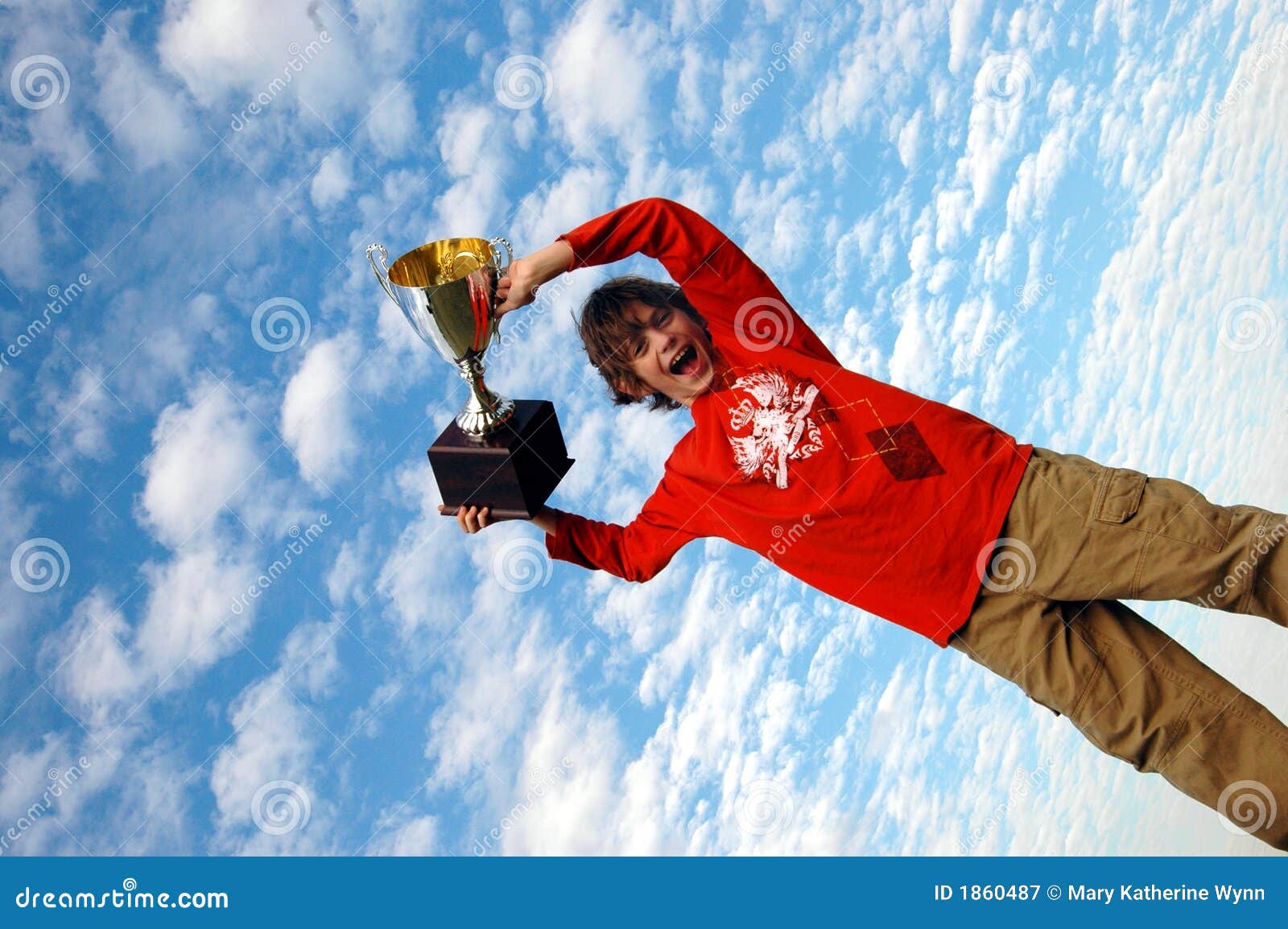 Boy holding up trophy stock image. Image of bright, clouds - 1860487