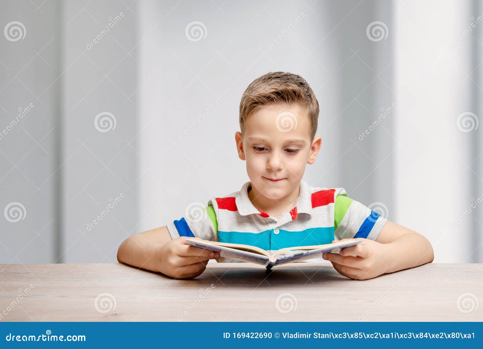 Boy Holds an Open Book. Concept of Learning and Studying Stock Photo ...