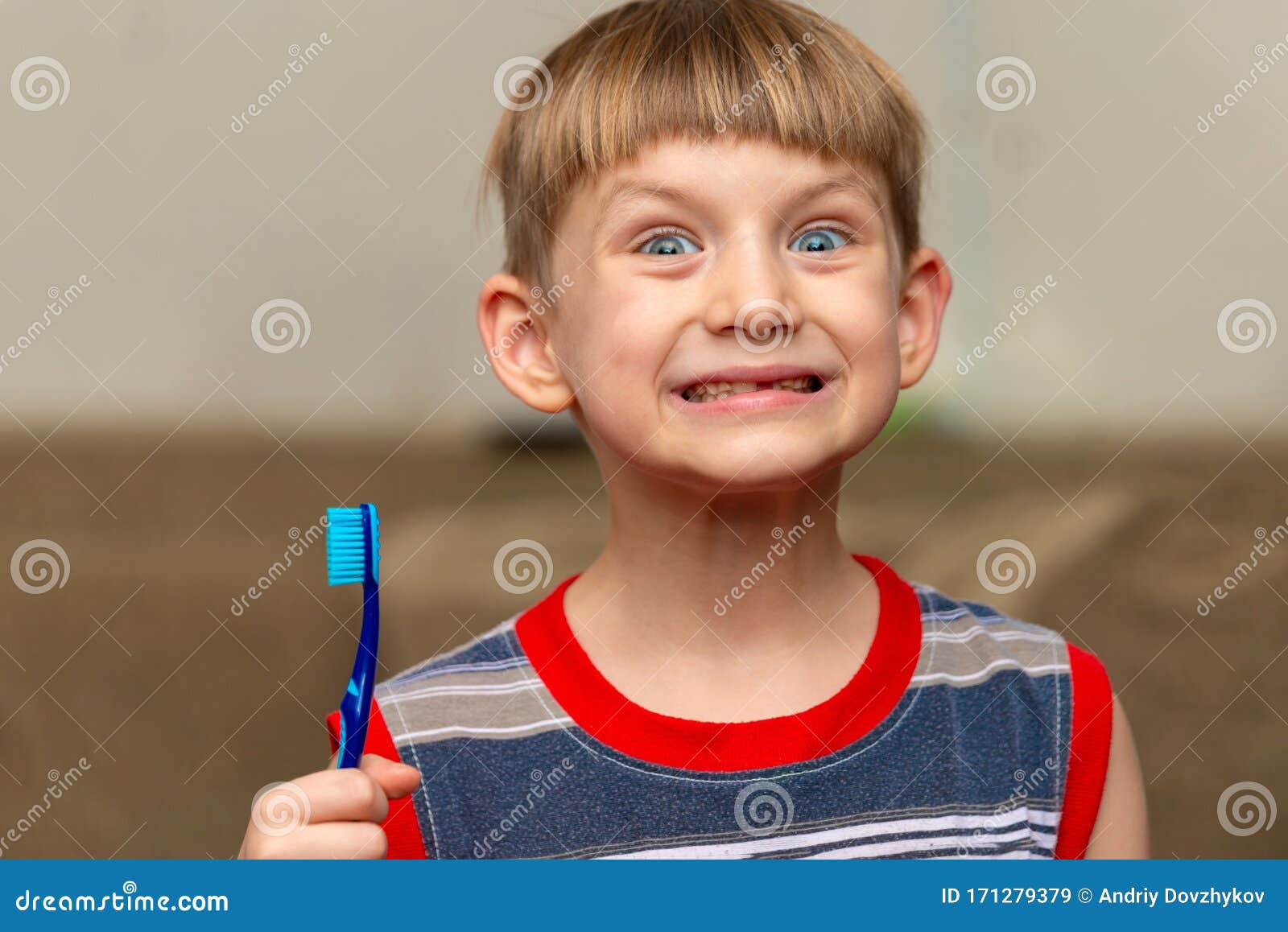 The Boy Holds a Toothbrush in His Hand Showing Clean Teeth Stock Image ...