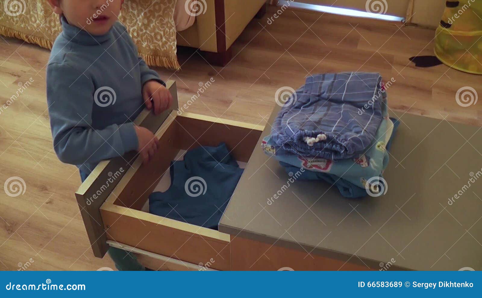 Boy home fold clothes stock video. Video of punctuality - 66583689