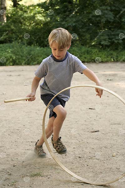 Boy in Hoop racing game stock photo. Image of child, compete - 13352696