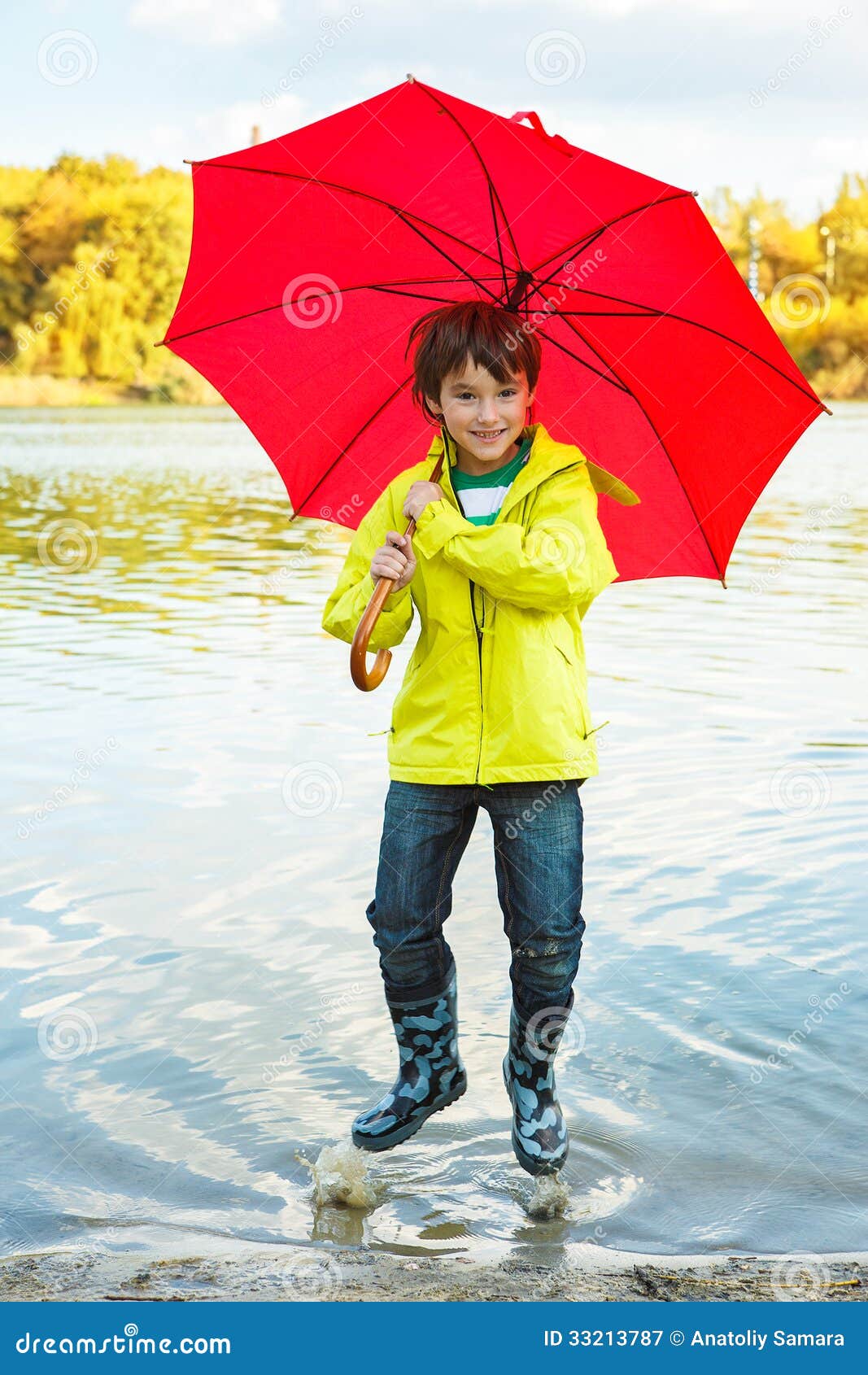Boy hopping in water stock image. Image of hold, autumnal - 33213787
