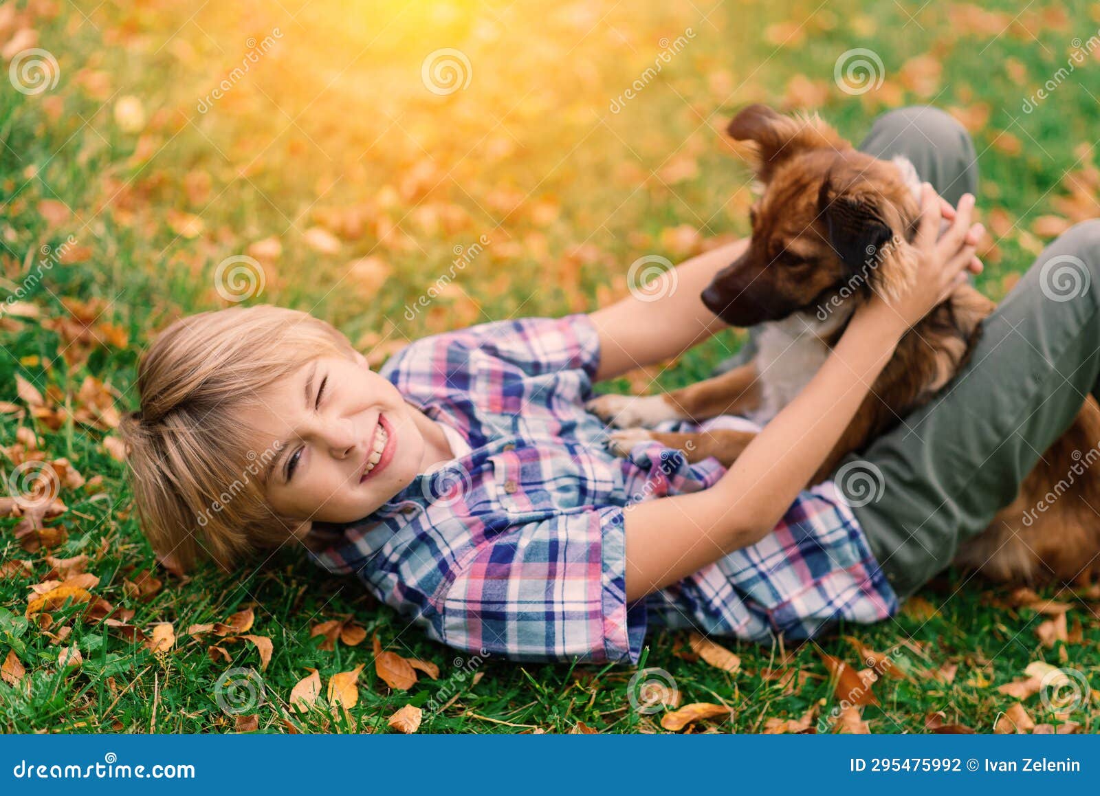 Boy Hugging Dog and Plyaing with in the Fall, City Park Stock Photo ...