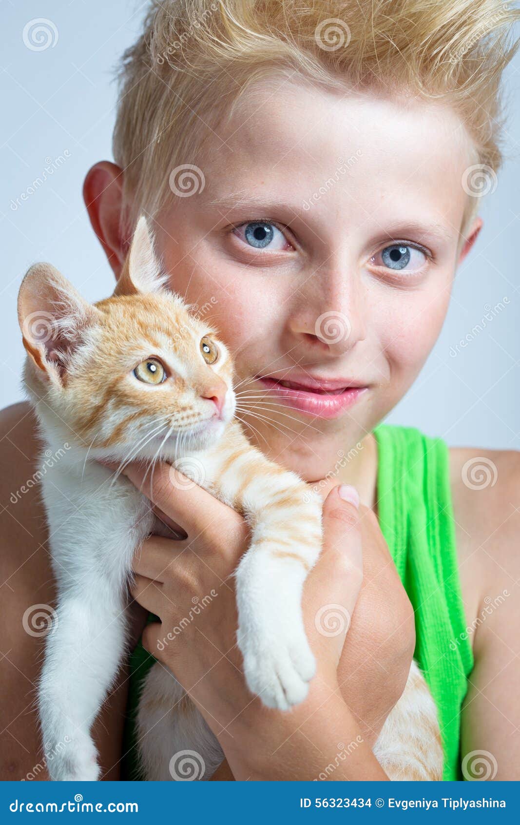 Boy hugging ginger kitten stock photo. Image of kitten - 56323434