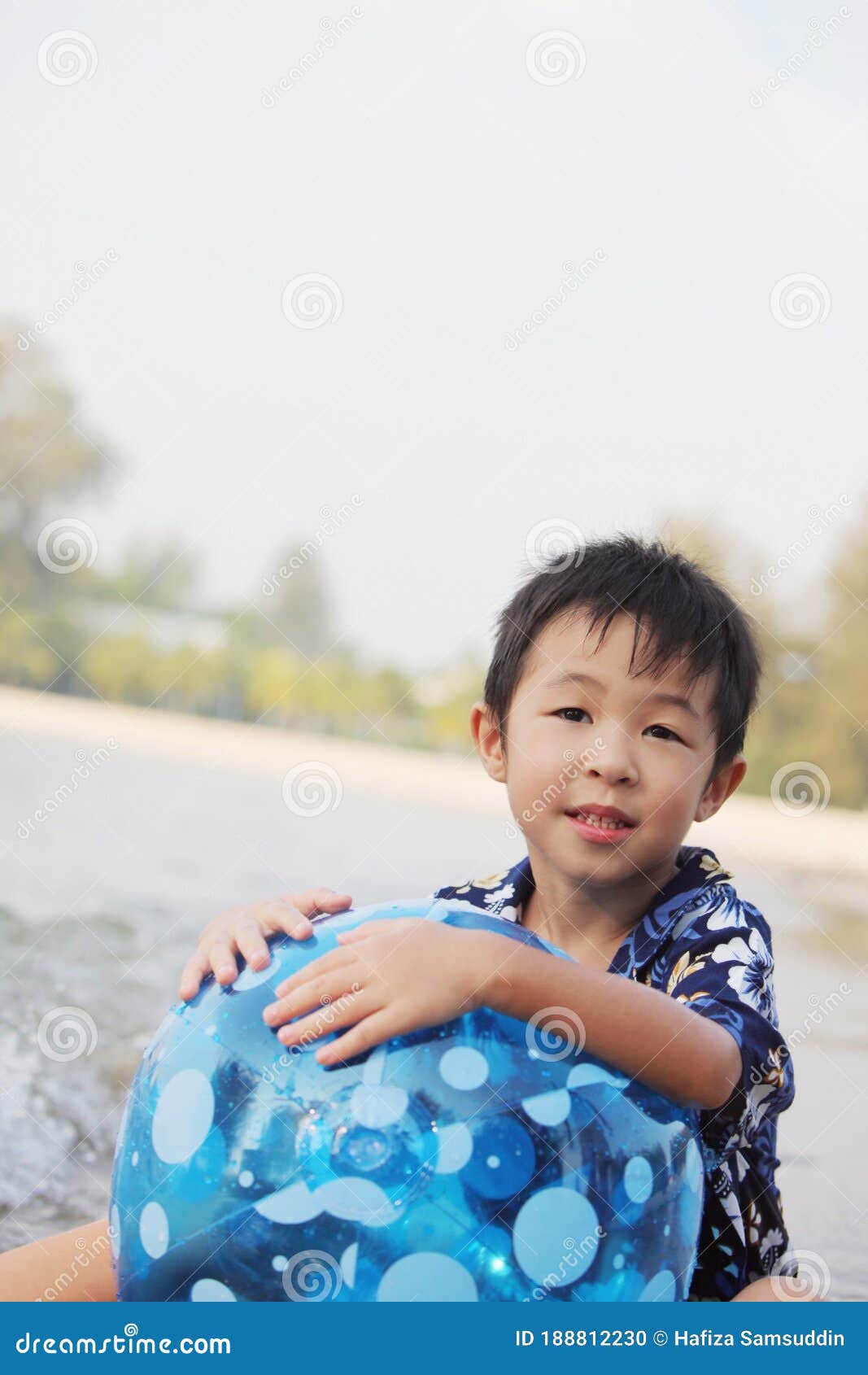 Boy Hugging His Beach Ball. Conceptual Image Stock Photo - Image of ...
