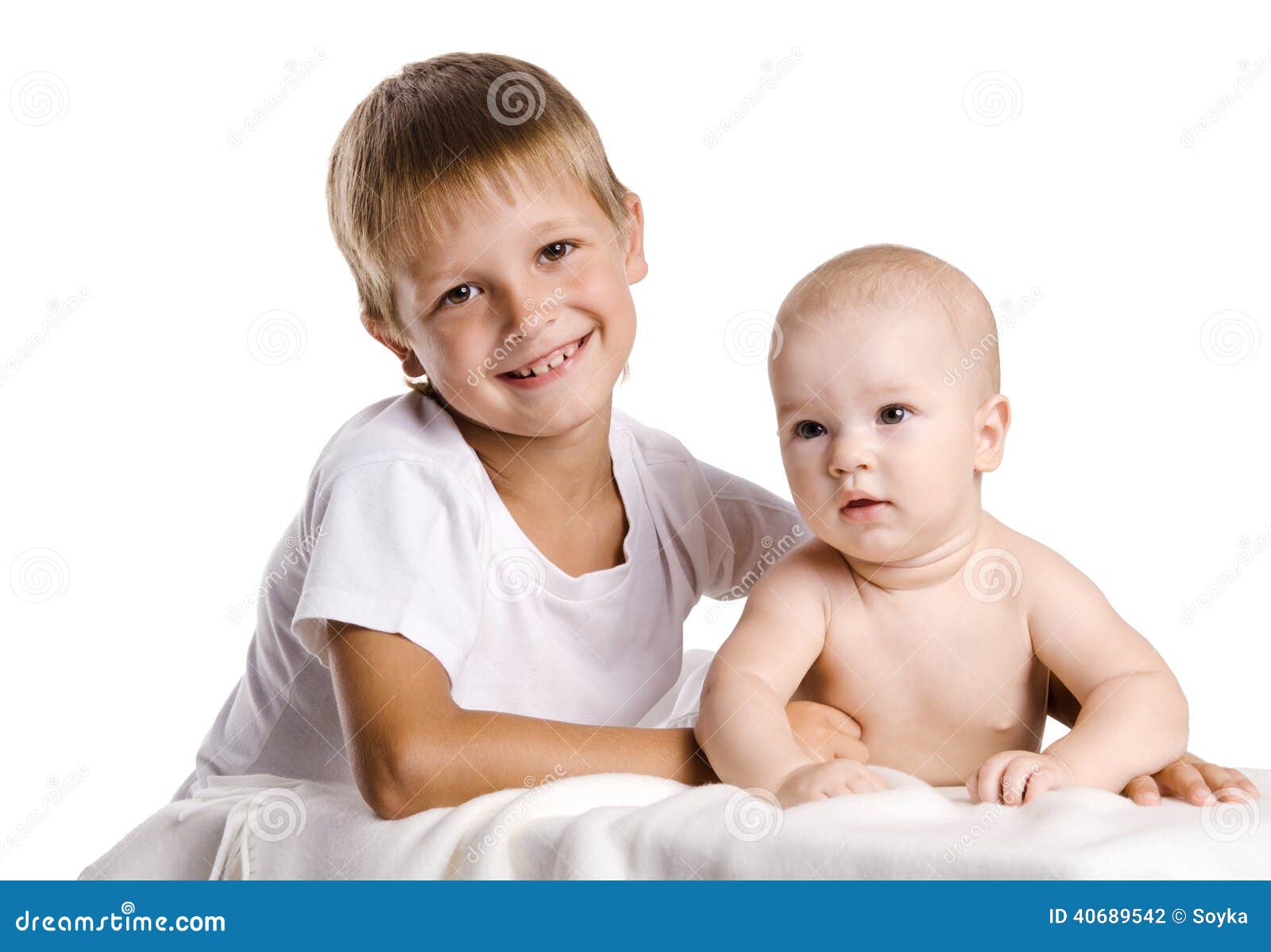 The Younger Brother Hugs The Older One And Looks At Him, Two Loving ...