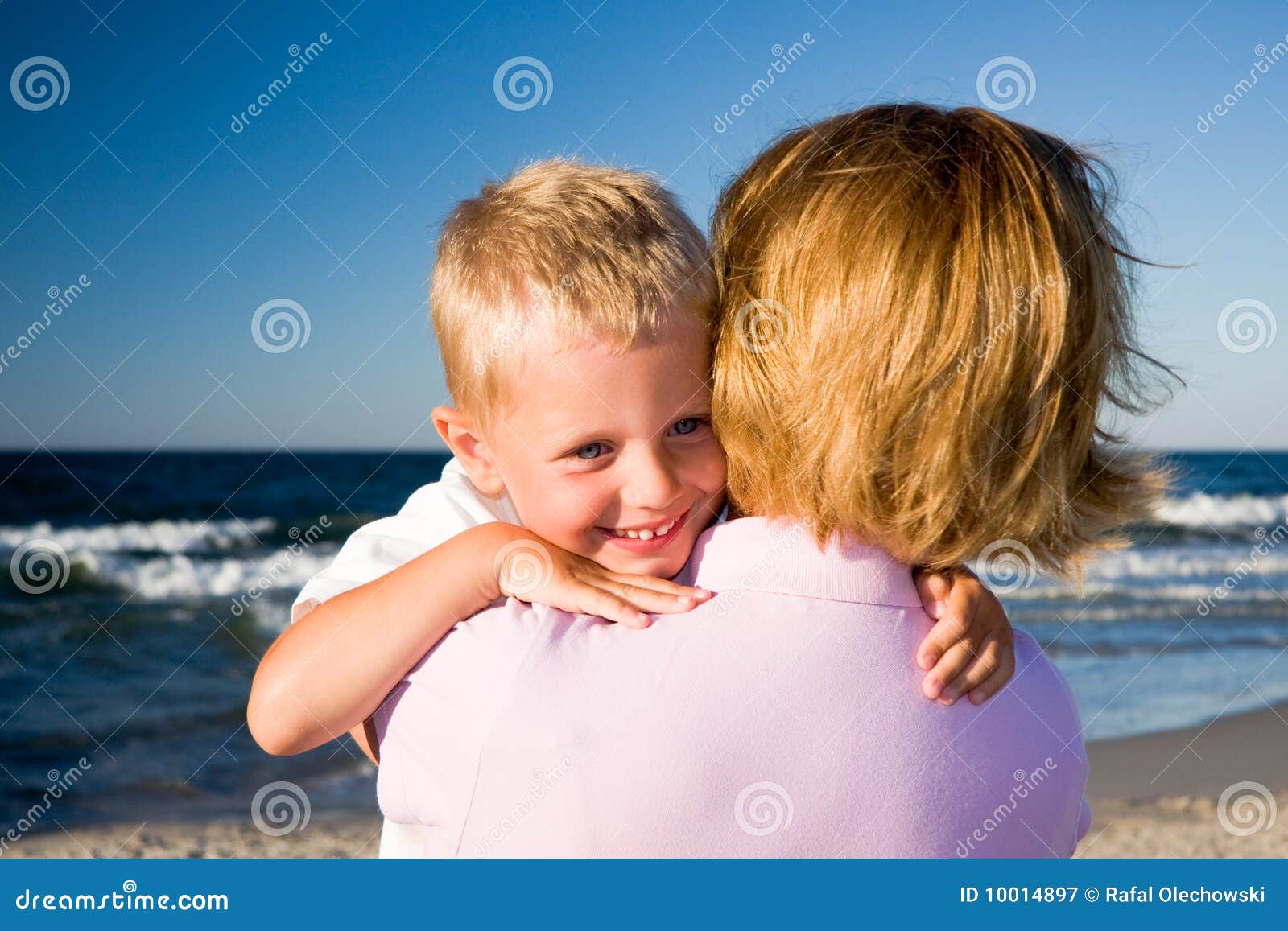 Boy Hugging Mother on Beach Stock Image - Image of life, looking: 10014897