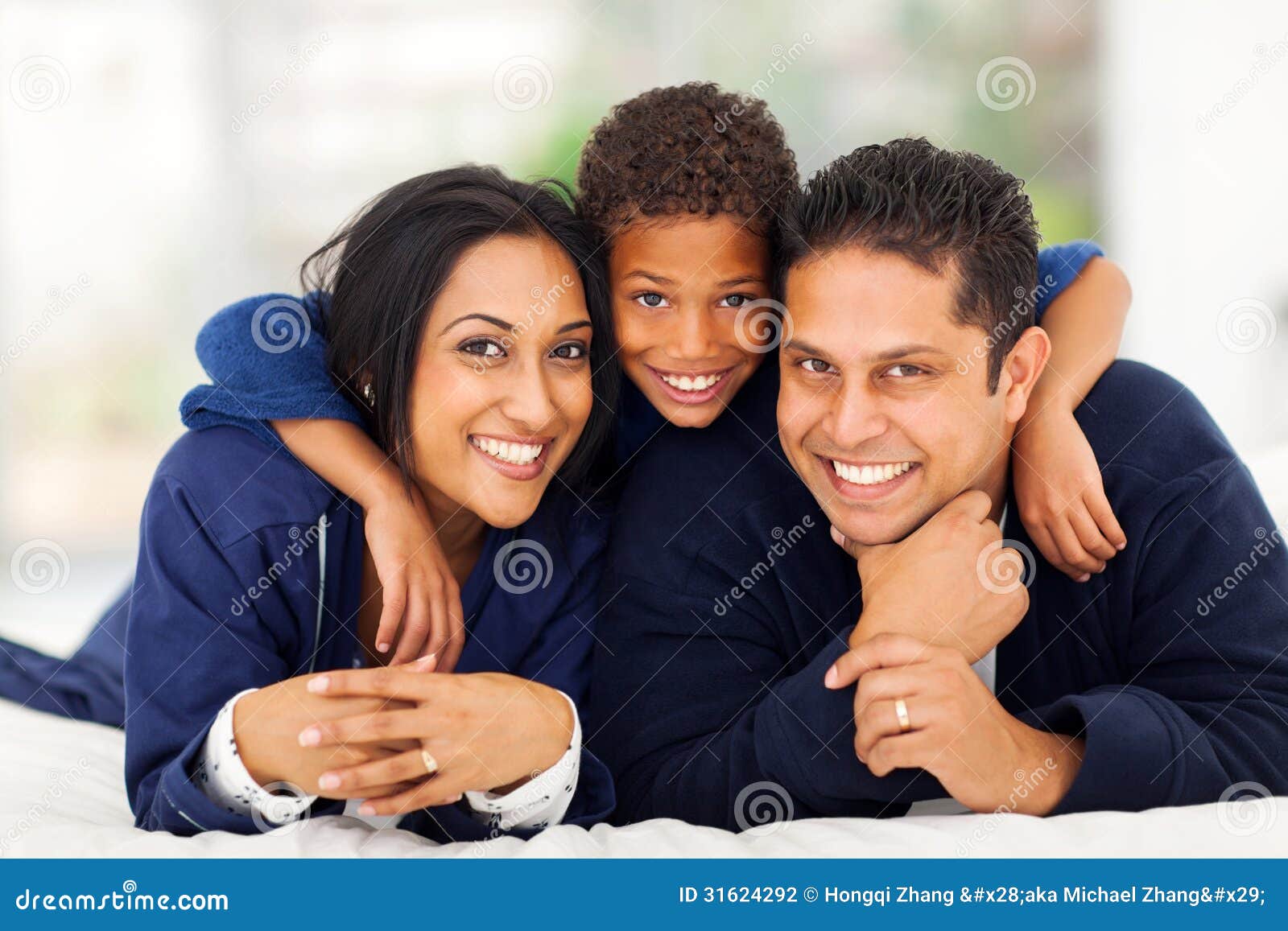 Boy Hugging Parents Stock Photos - Download 2,668 Royalty Free Photos