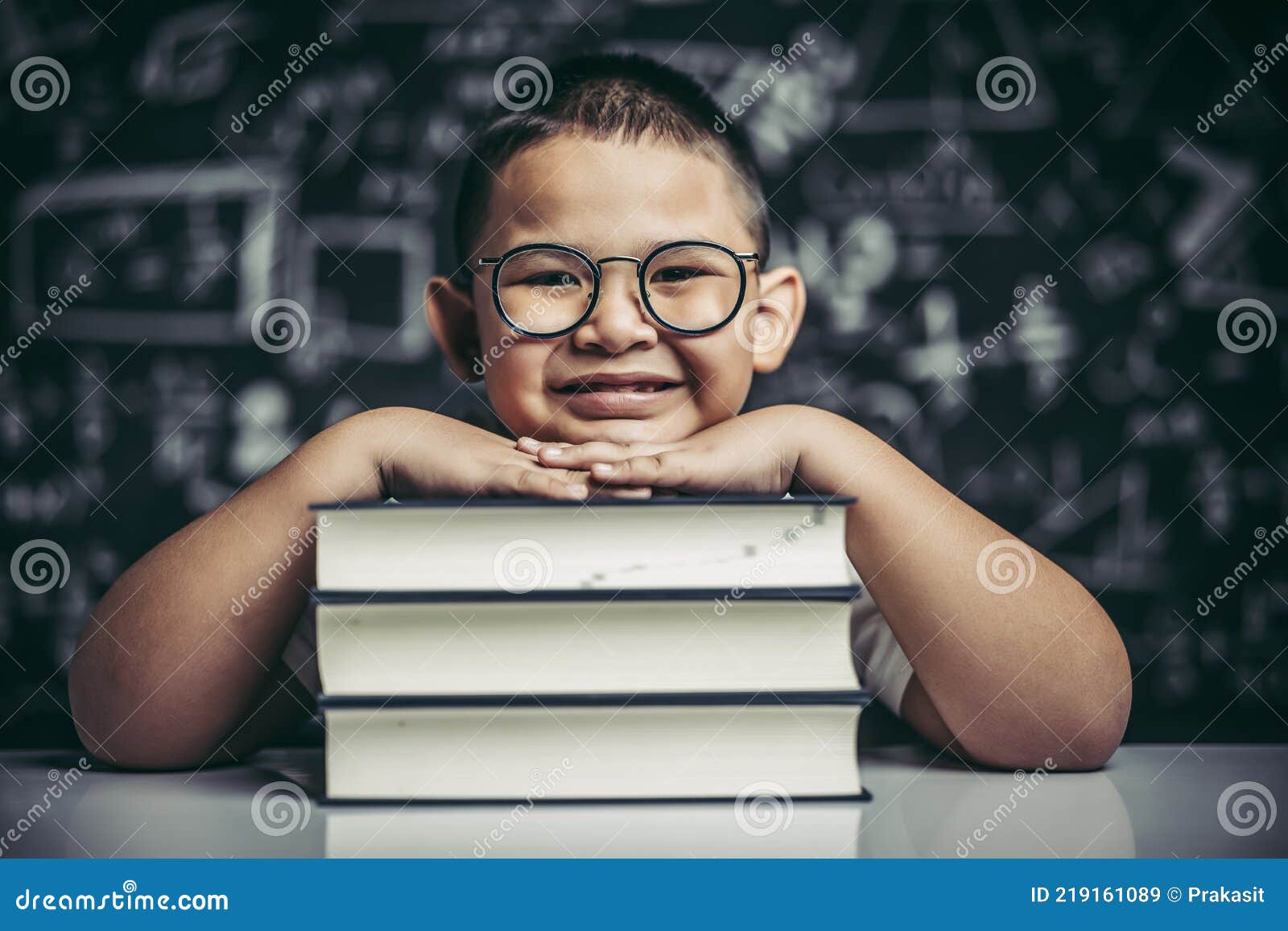 A Boy Hugging a Pile of Books Stock Image - Image of student, knowledge ...