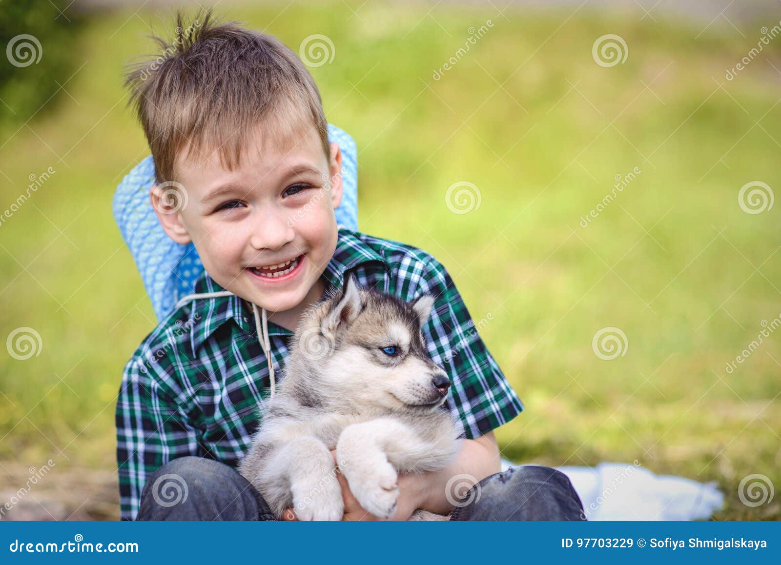 The boy with husky puppy stock image. Image of alaskan - 97703229