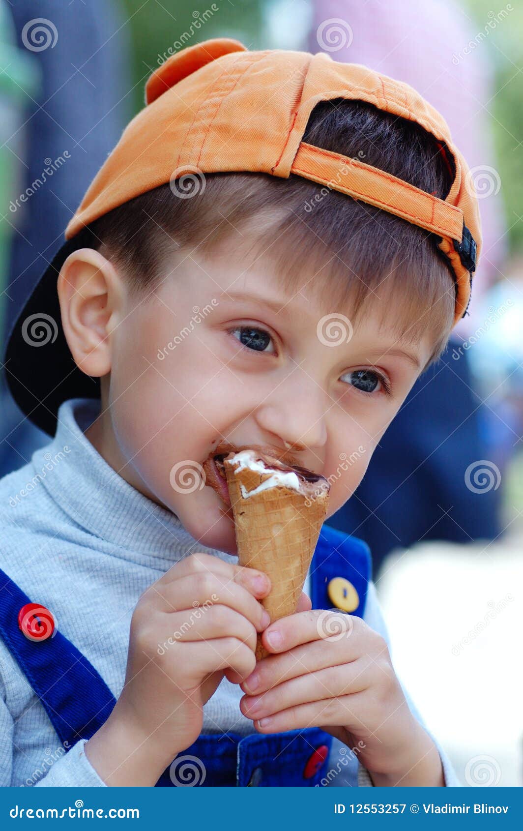 Boy with ice cream stock image. Image of walk, orange - 12553257