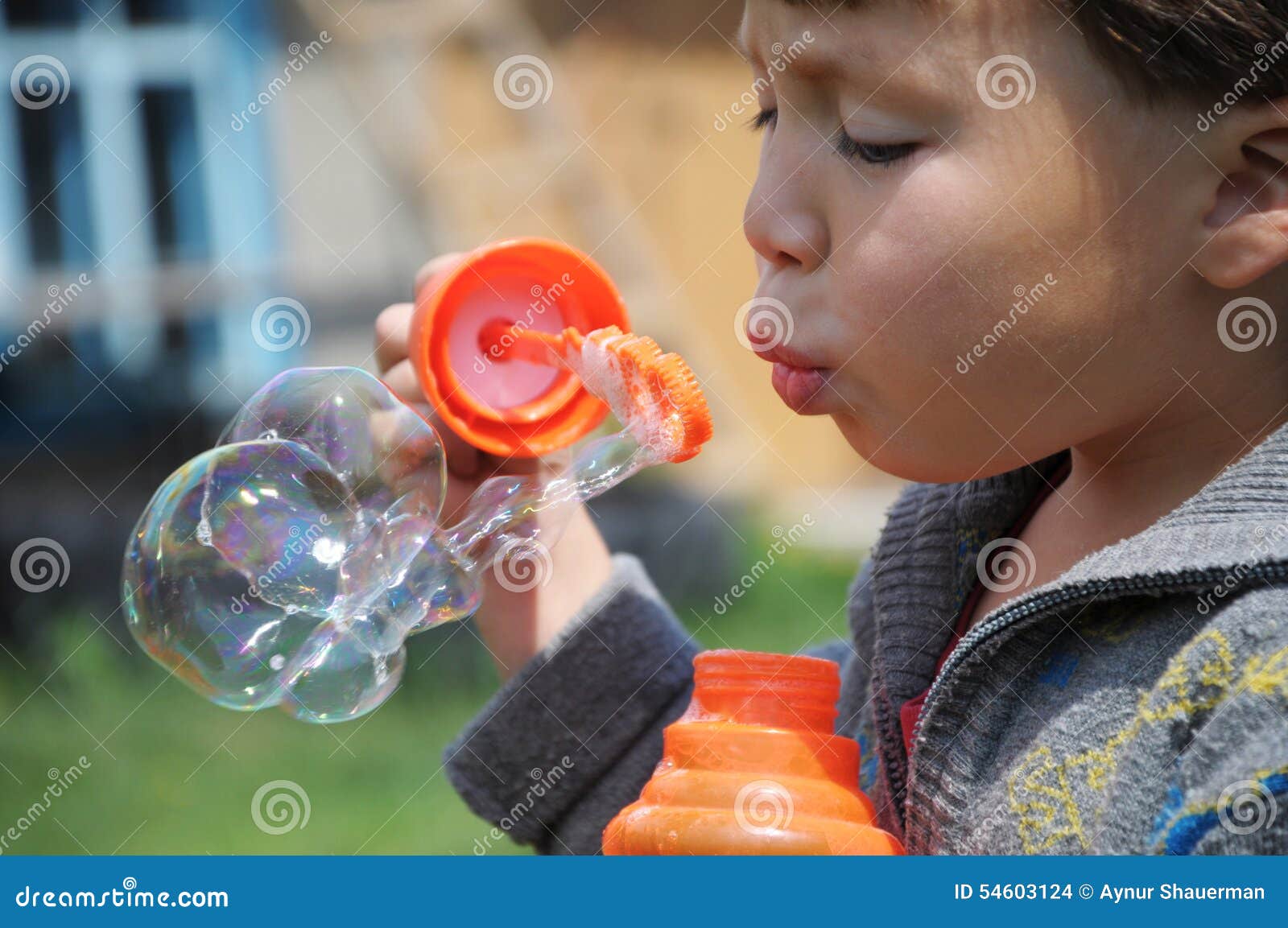 Boy inflating the bubble stock photo. Image of blowing - 54603124