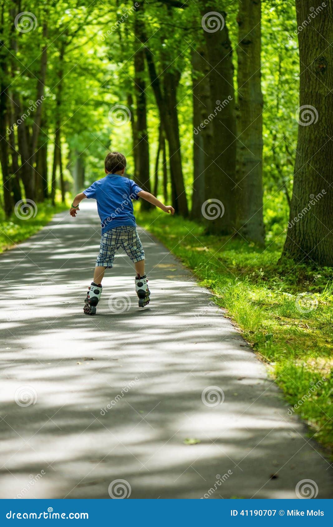 Boy on inline skates stock image. Image of skating, back - 41190707