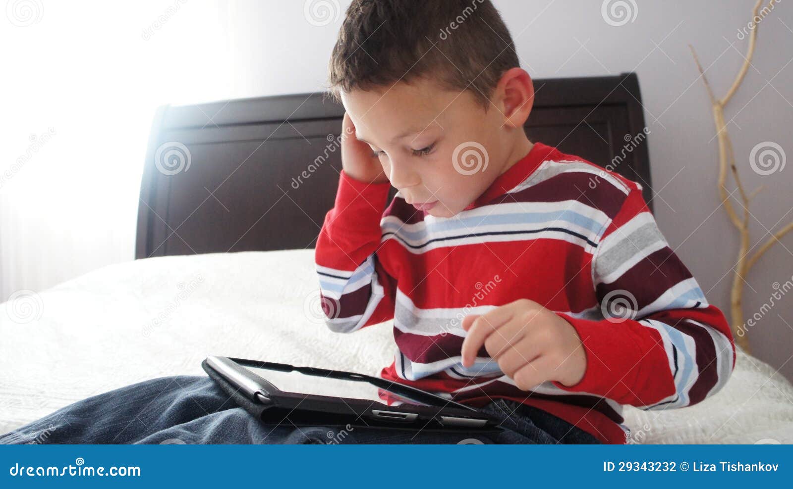 Boy Playing Games On Ipad
