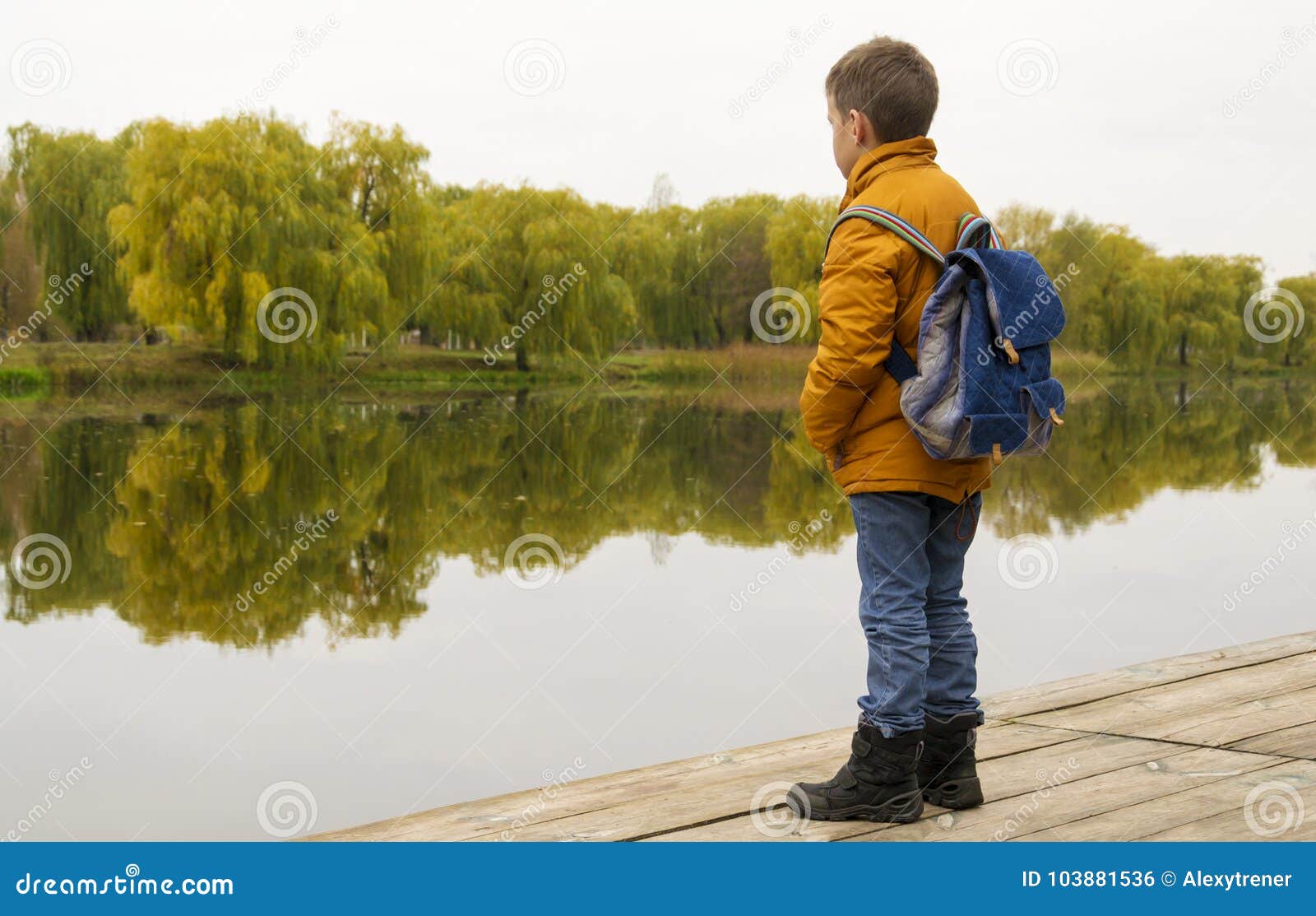 Boy in Jacket with Backpack Standing at Pier Stock Photo - Image of ...