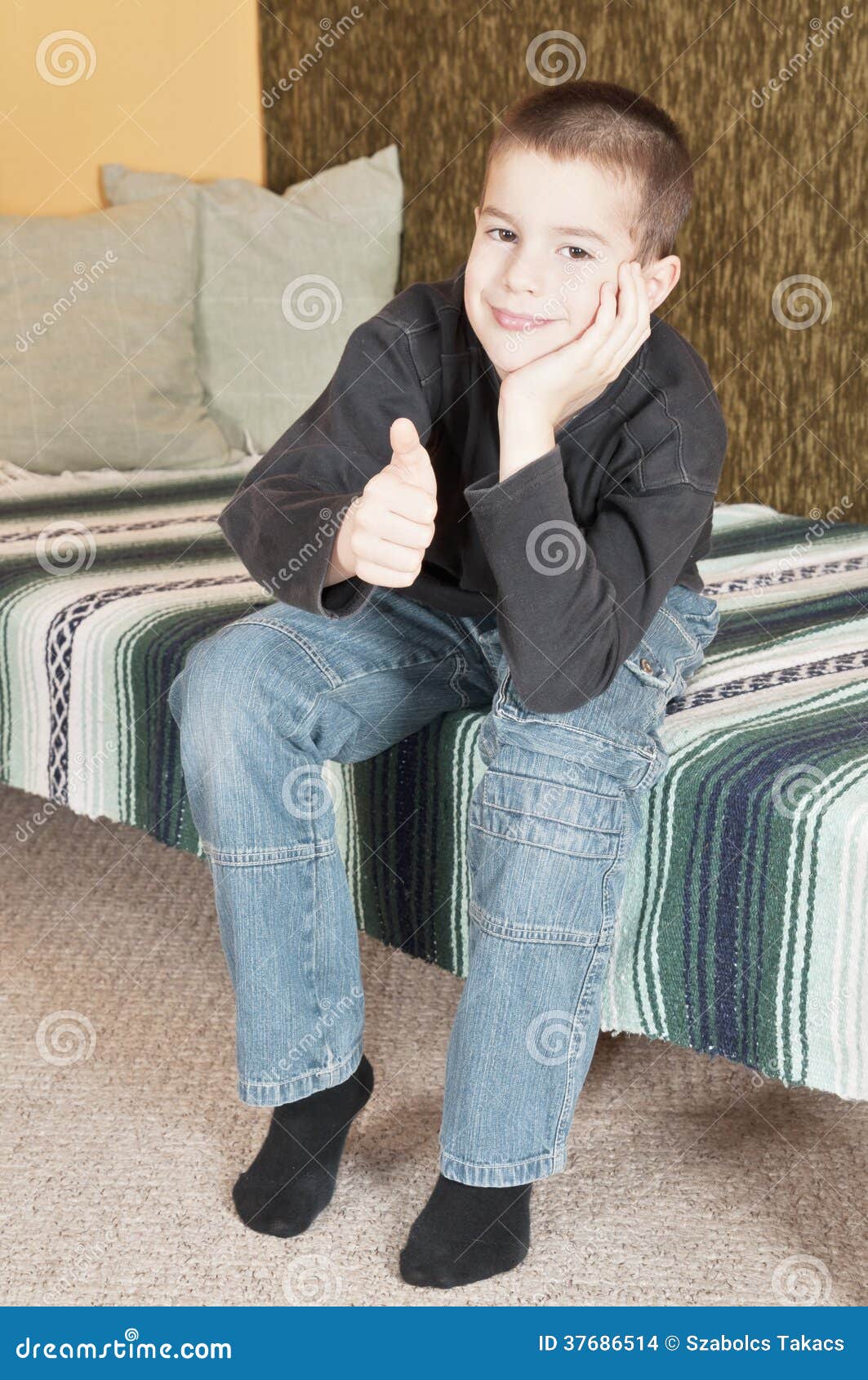 Boy jauntily showing OK stock photo. Image of male, black - 37686514