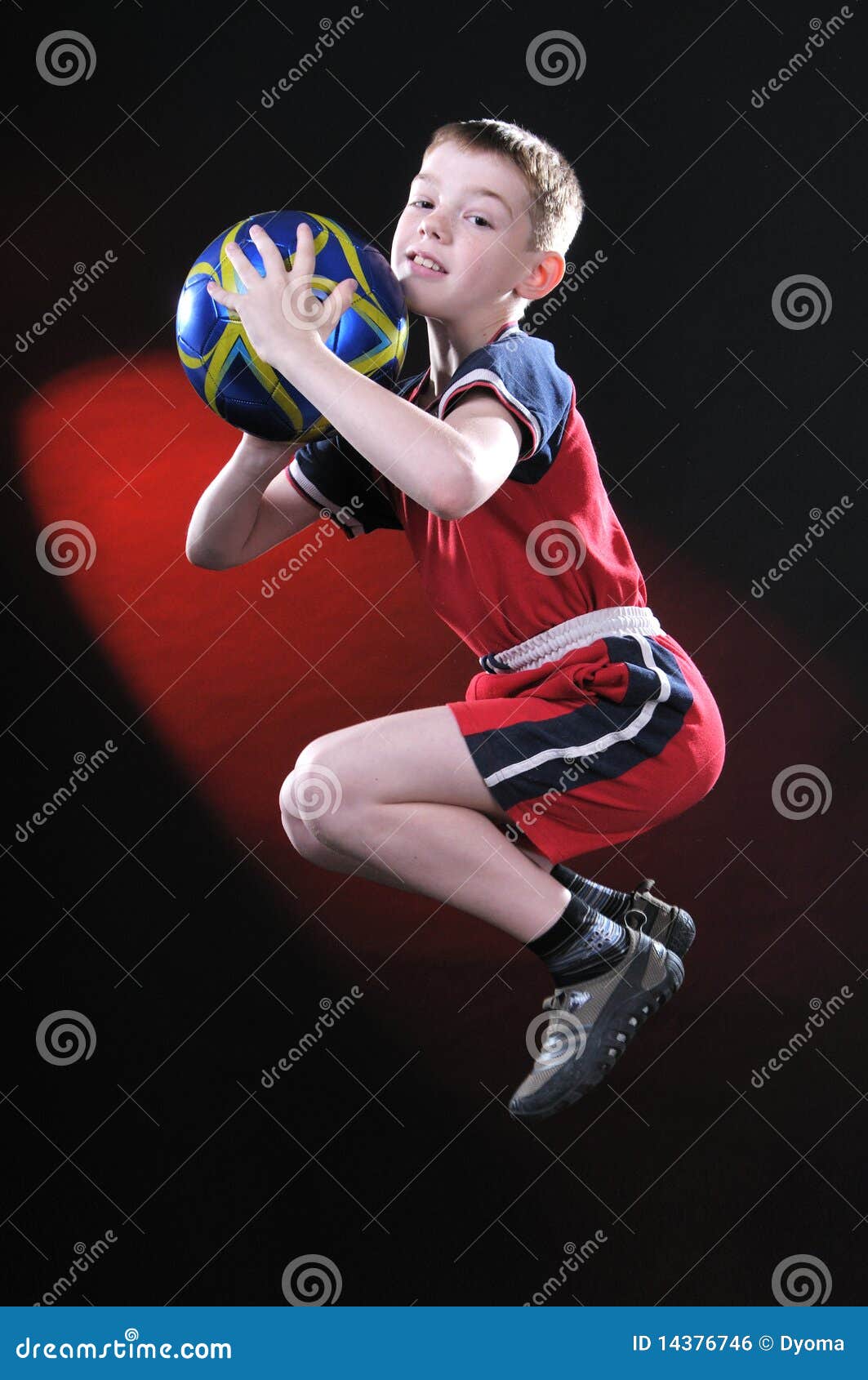 Boy In Jump Catches A Soccer Ball Stock Photo - Image of photo, freedom ...