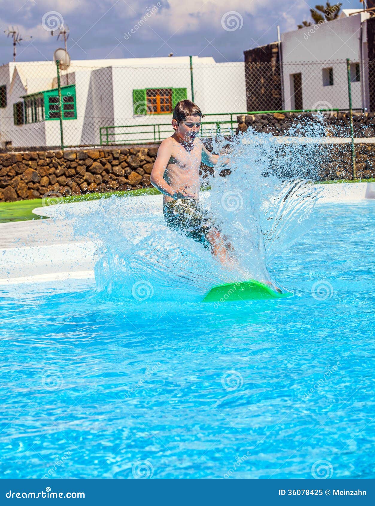 Boy Jumping in the Blue Pool Stock Image - Image of child, summer: 36078425